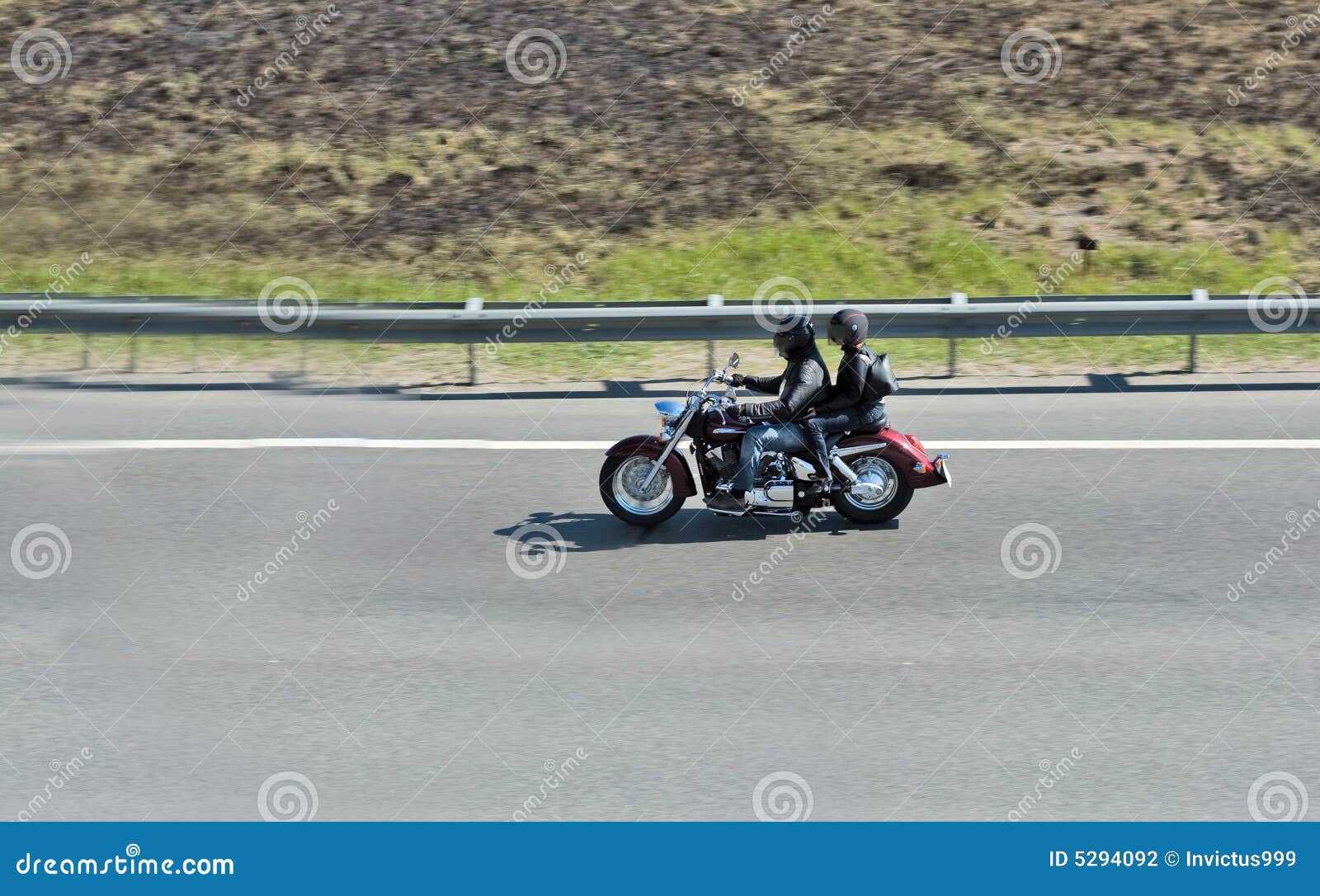 Biker on Chopper and His Passenger Stock Photo - Image of blur ...