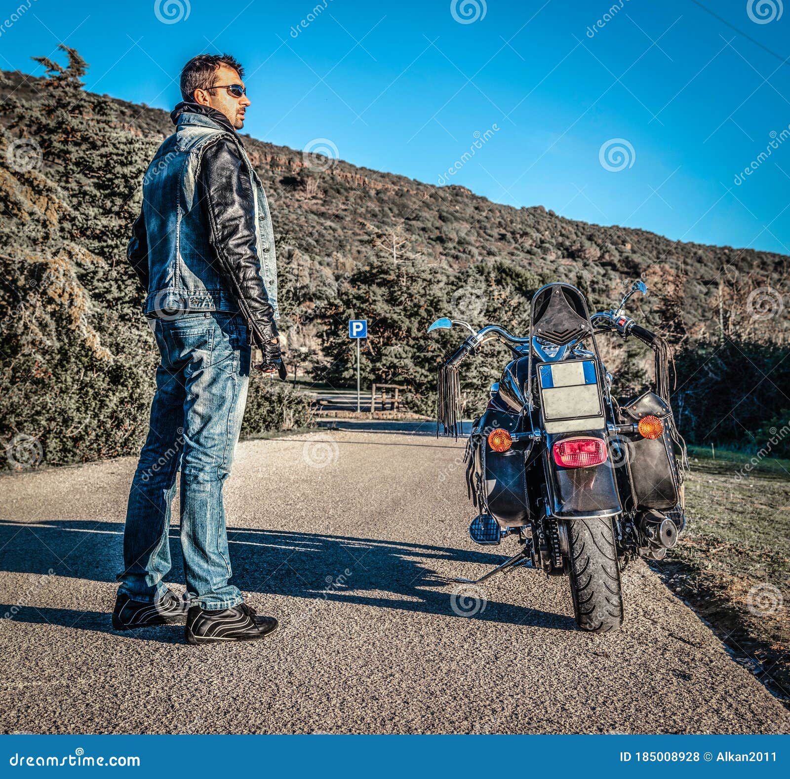 Biker and Classic Motorcycle on a Country Road Stock Photo - Image of ...
