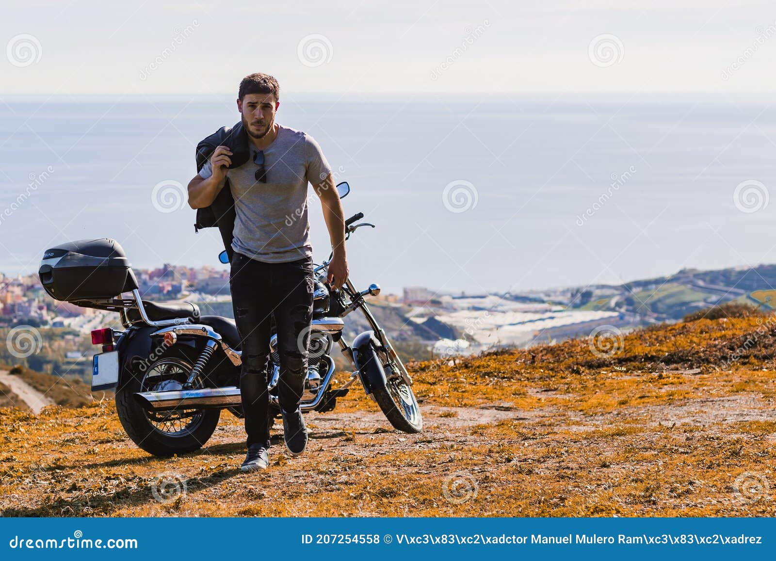 Biker in Leather Jacket Walking Away from the Motorcycle Stock Photo ...