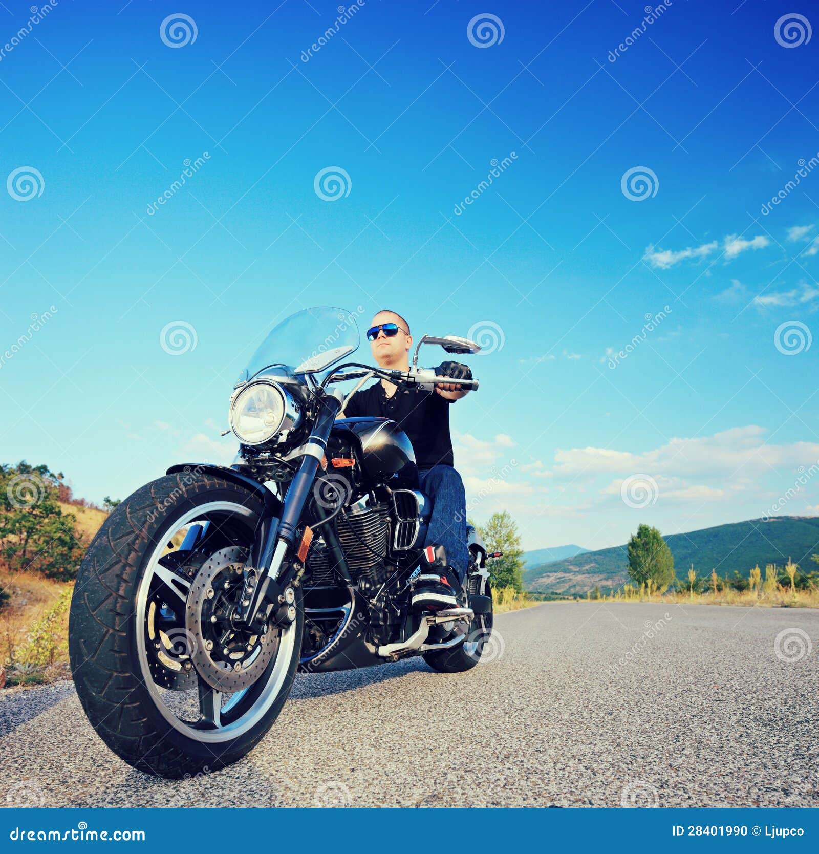 Biker Riding a Customized Motorcycle on an Open Road Stock Photo ...