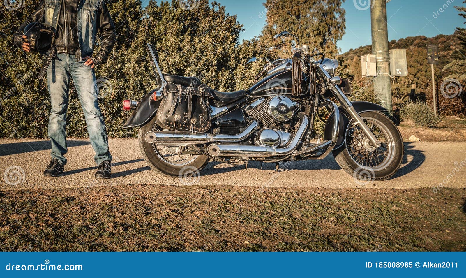 Biker Standing by a Classic Motorcycle Stock Image - Image of evening ...