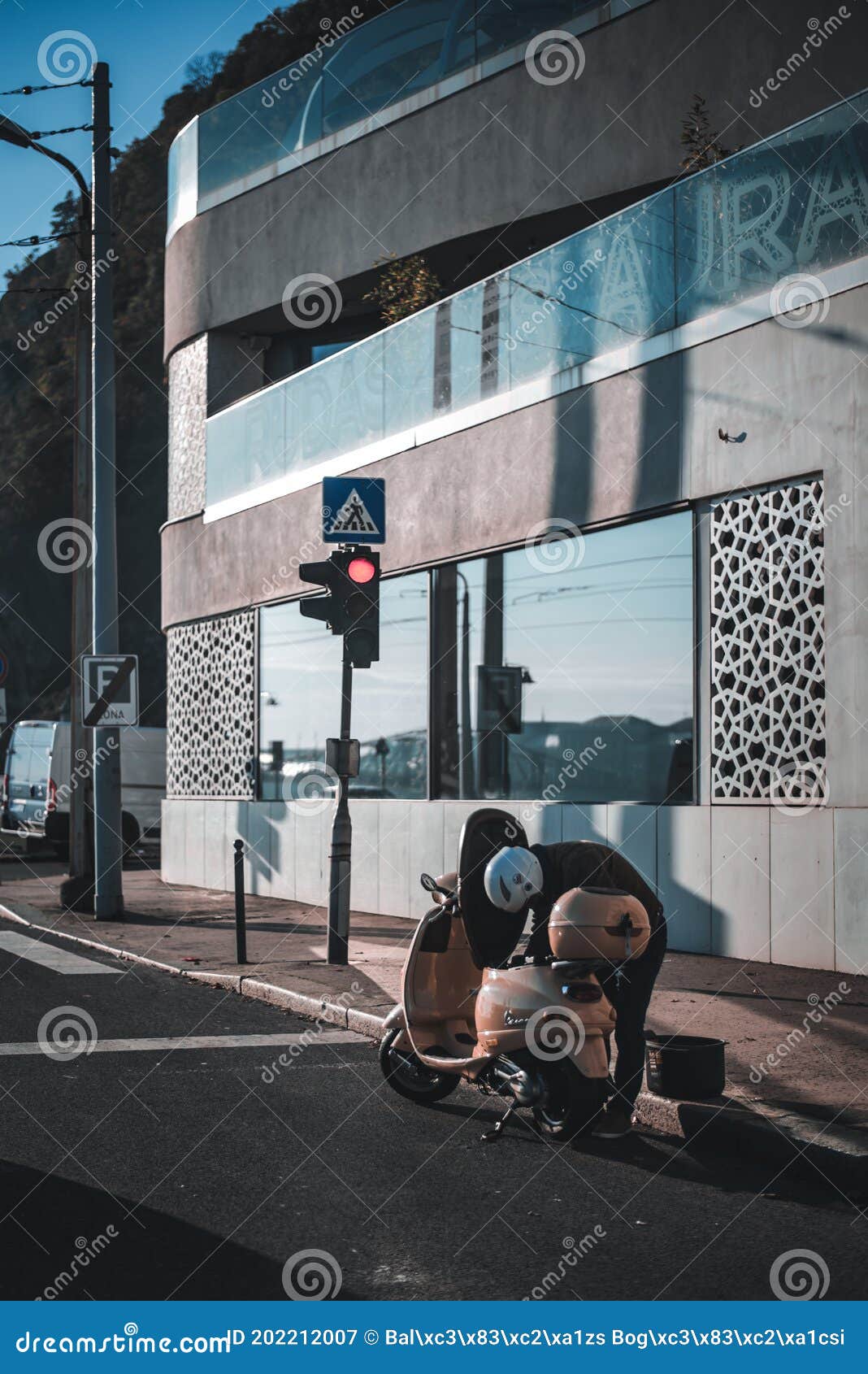 Biker at red lights editorial photography. Image of city - 202212007