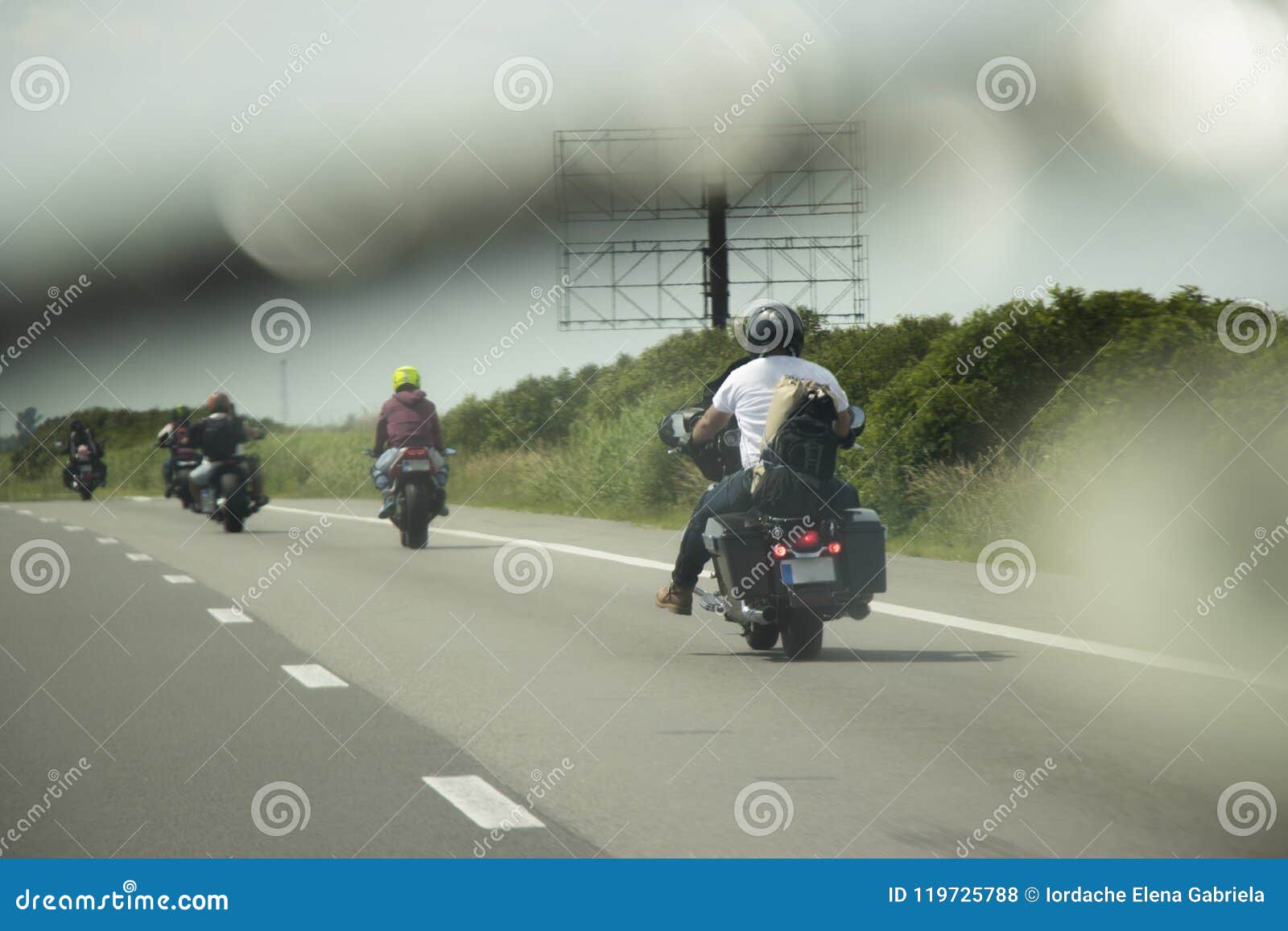 Bikers riding on the road stock photo. Image of background - 119725788