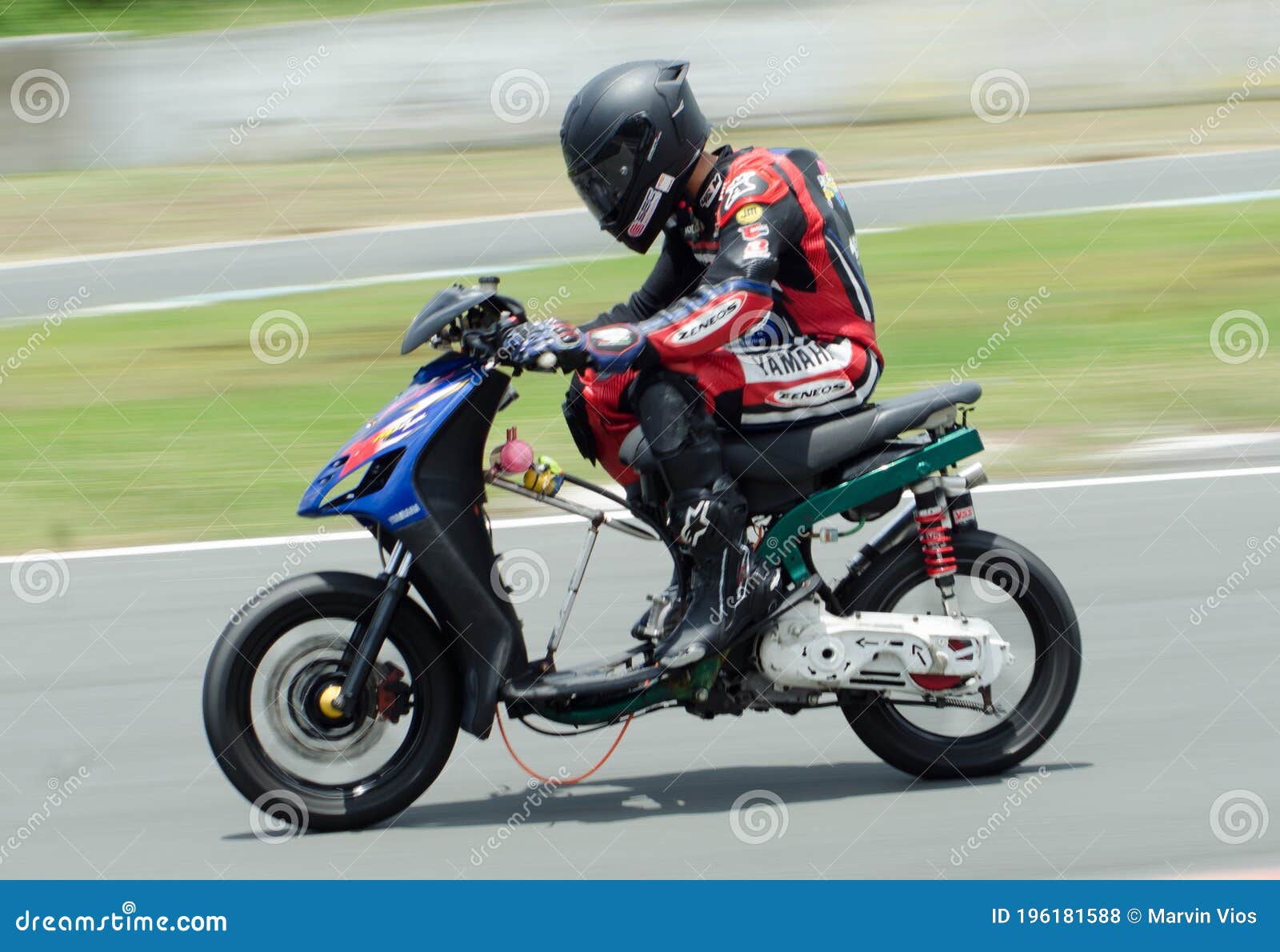 Scooter Bikes on the Track editorial stock photo. Image of helmet ...