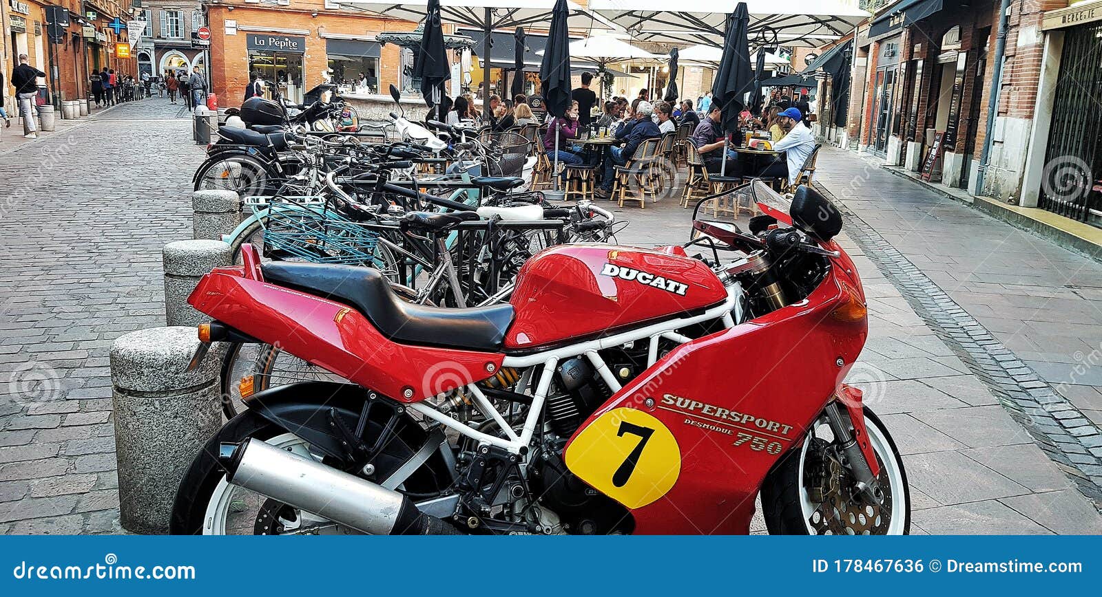 Bikes and Ducati in the City Editorial Photo - Image of person ...