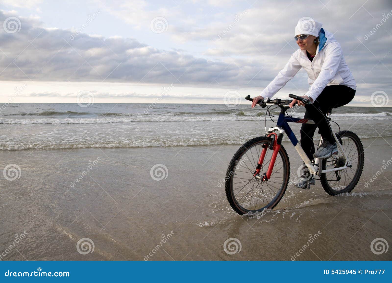 Biking on the beach stock image. Image of outdoors, sunshine - 5425945