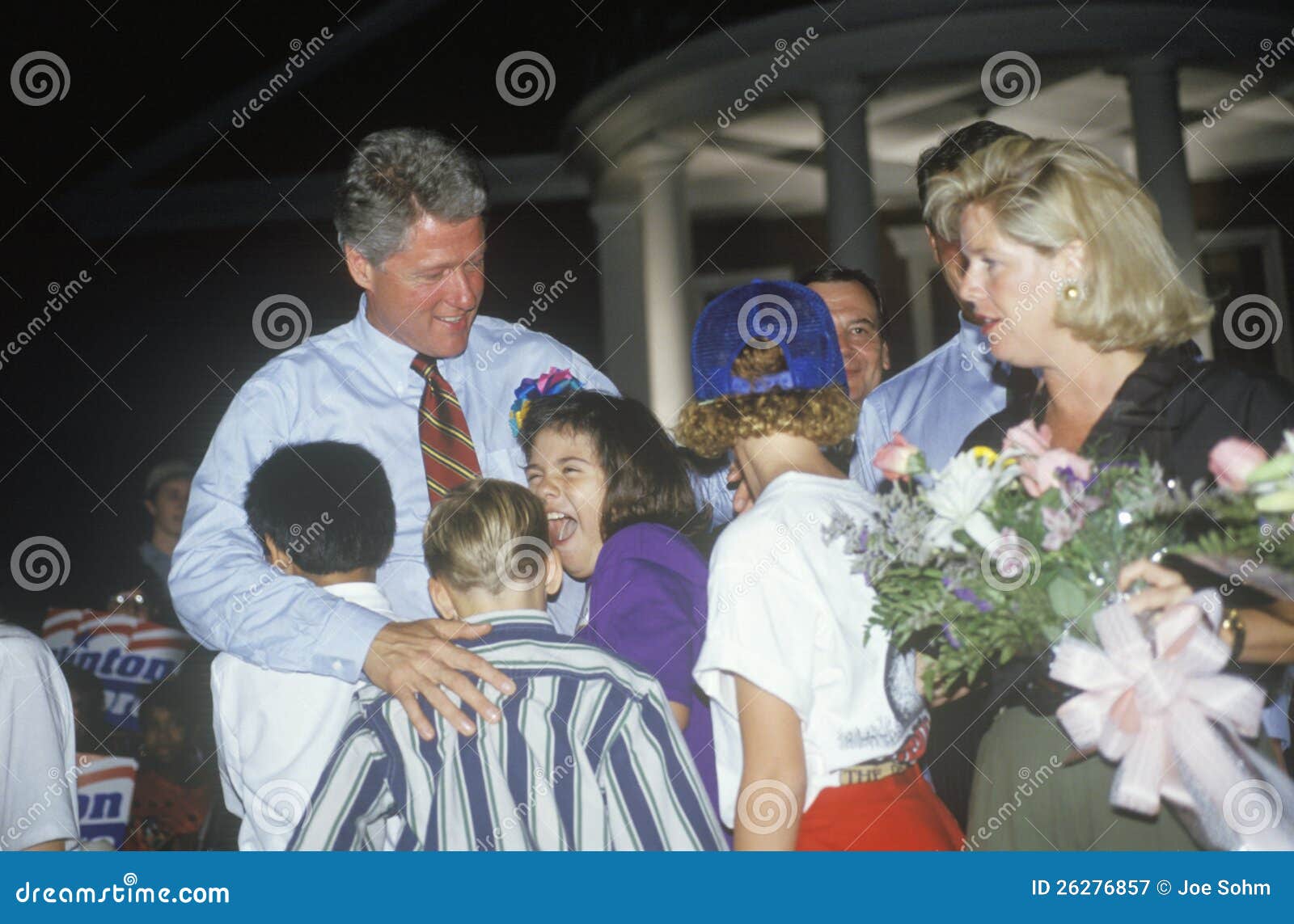 Bill Clinton Embraces a Group of Children Editorial Photography - Image ...