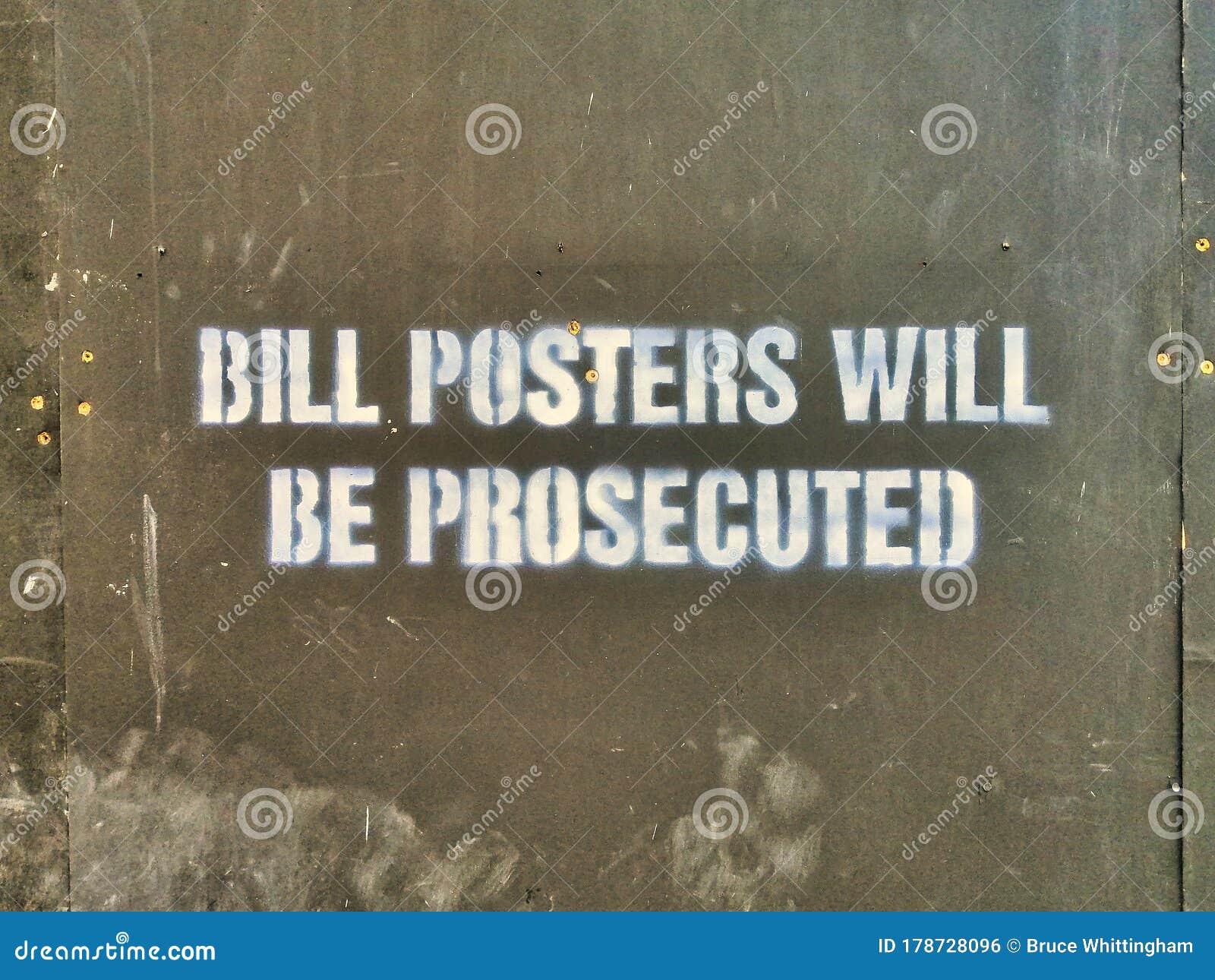 Bill Posters Will Be Prosecuted Sign on Black Wall Stock Photo - Image ...