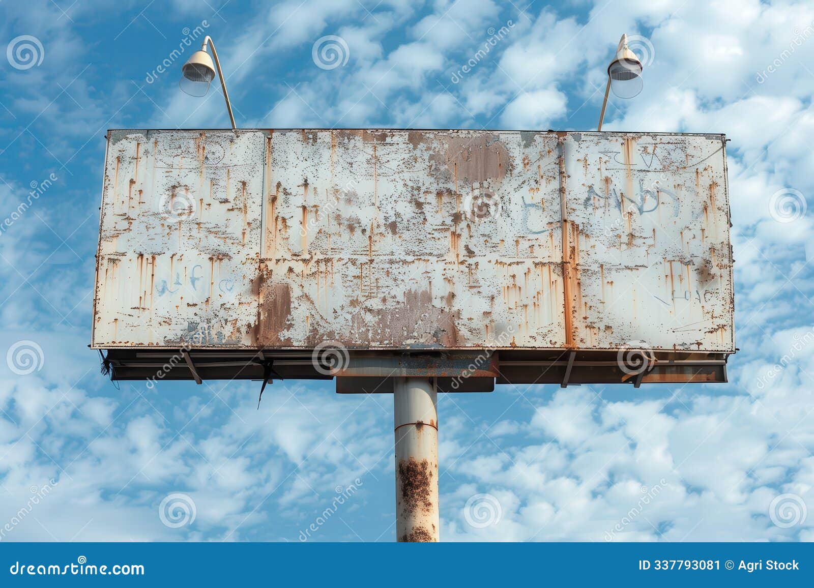 Billboard with Rusted Frame and Lights Shining on a Bright Background ...