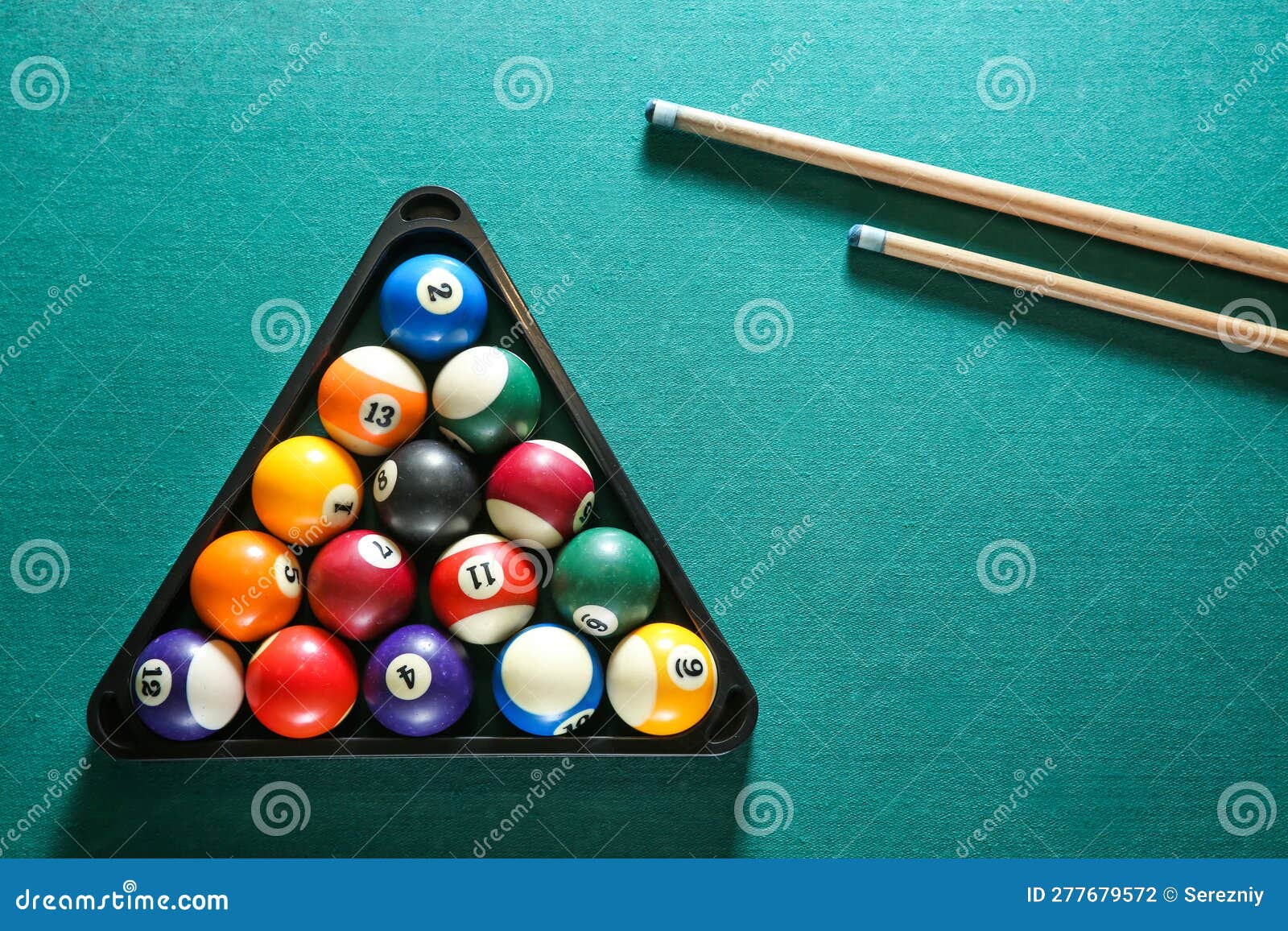 Billiard Balls in Triangle Rack with Cues on Table Stock Photo - Image ...