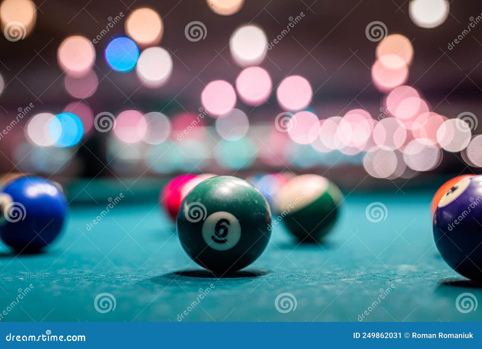 Billiard Colored Balls and Wooden Cue are Scattered on a Beautiful ... Billiard Colored Balls and Wooden Cue are Scattered on a Beautiful ...