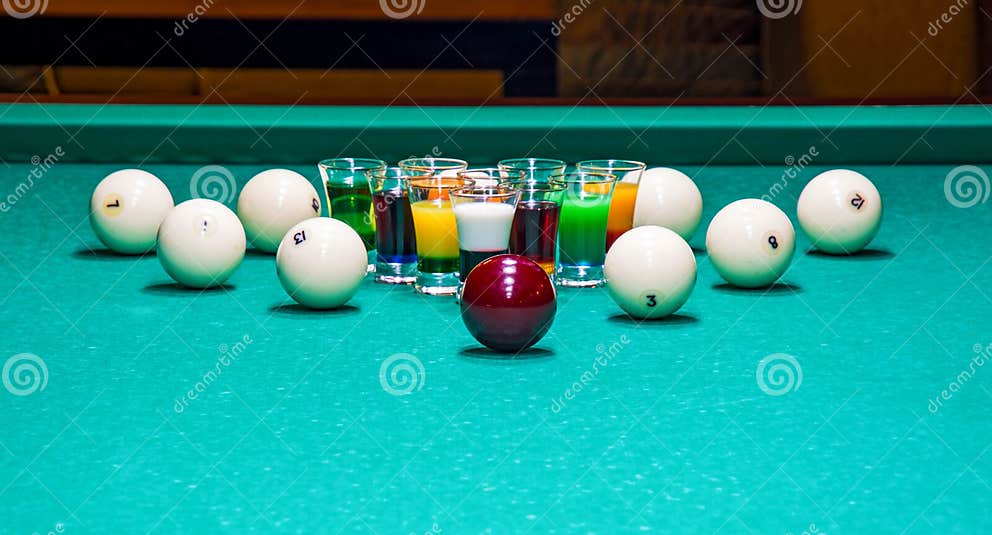 On a Billiard Table Stand with Coloured Glasses of Alcohol. Stock Image ...