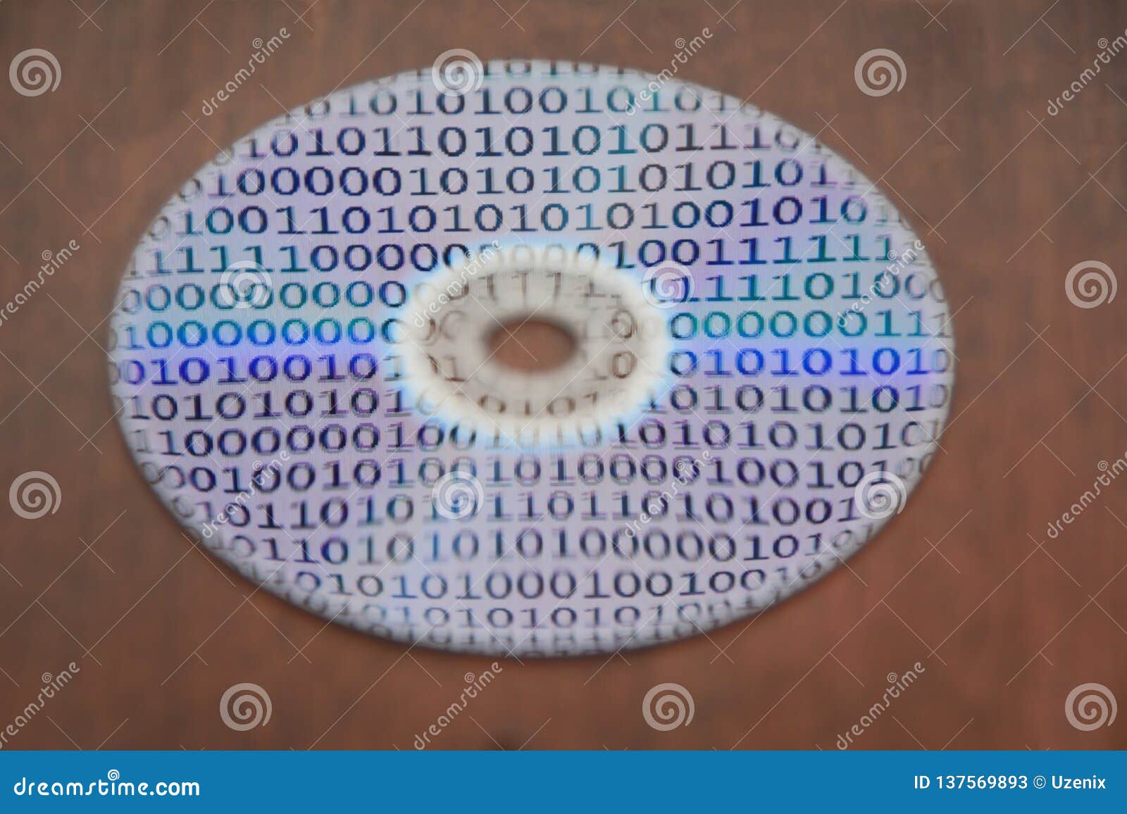 Binary Code Reflected in a Compact Disk Surface Against the Background ...