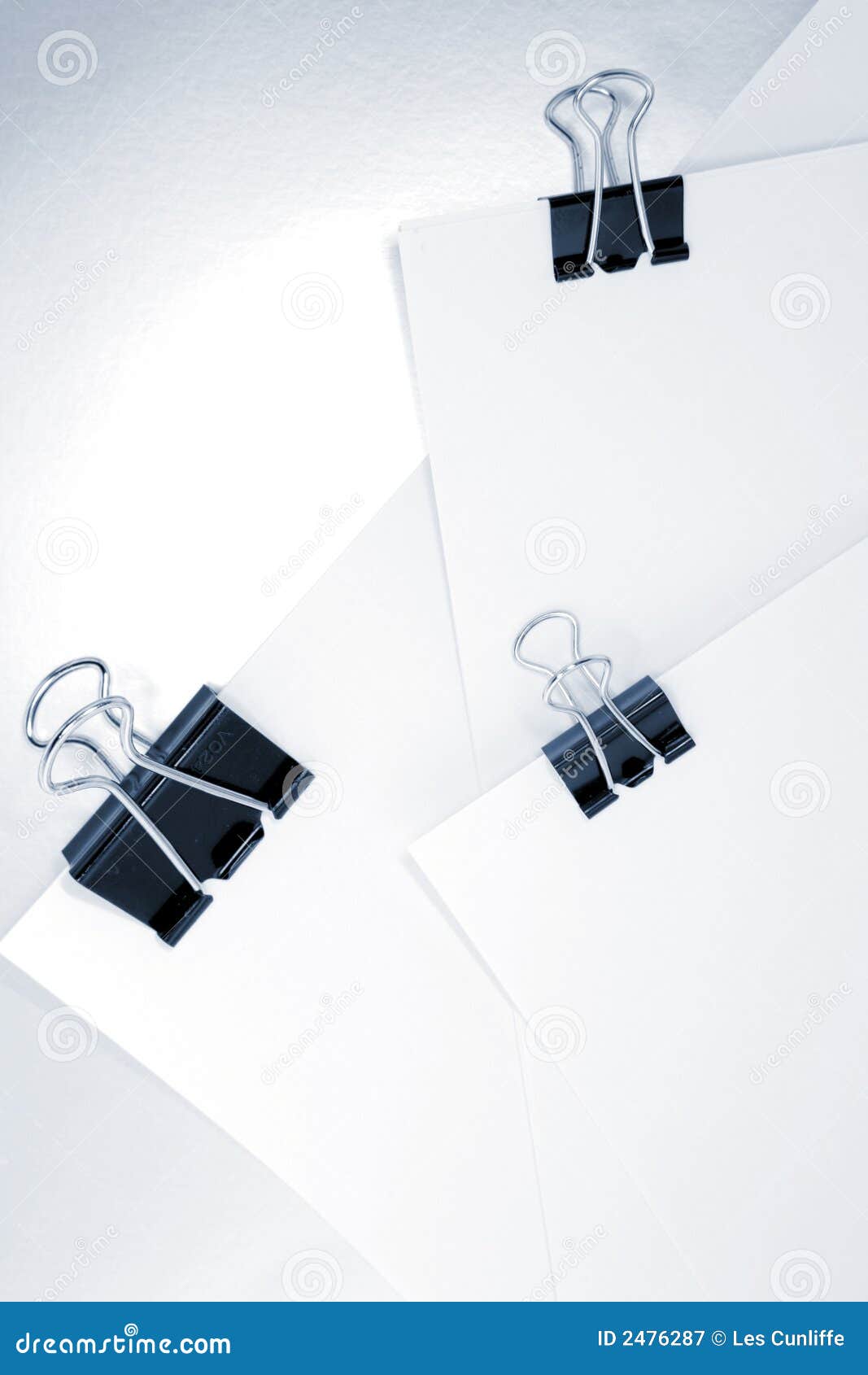 Binder clips on paperwork stock image. Image of office - 2476287