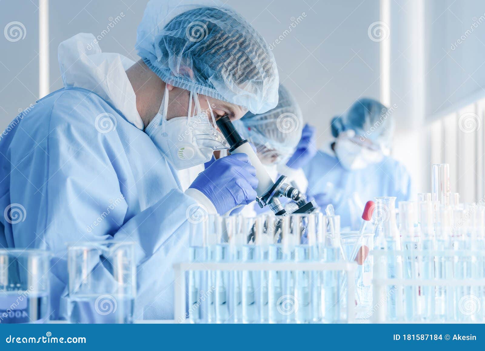 Biochemical Research Scientist Team Working with Microscope for ...