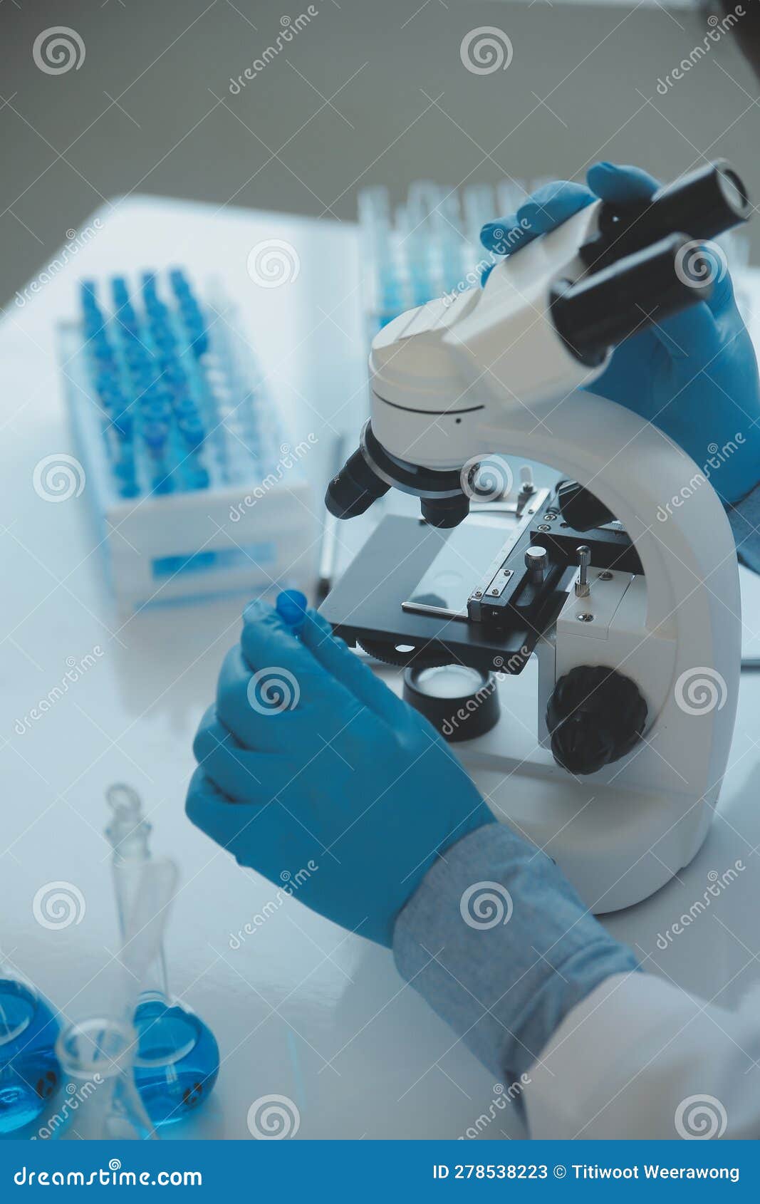 Biochemical Research Scientist Team Working with Microscope for ...