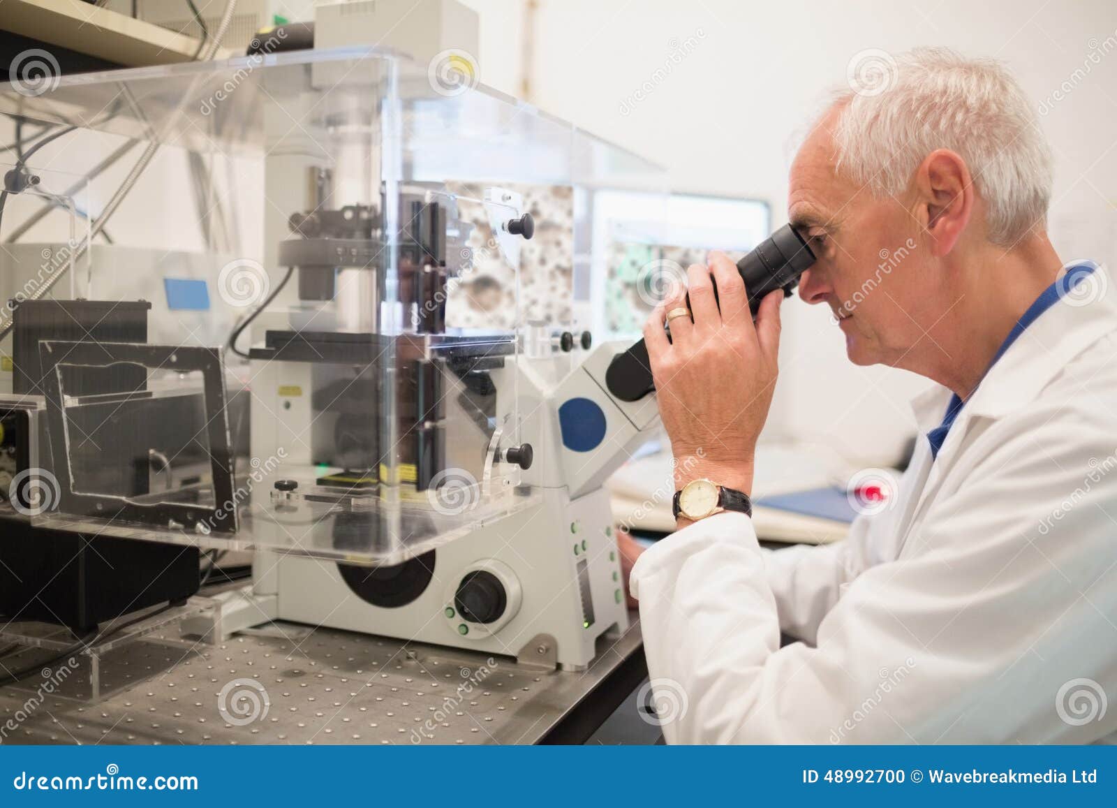 Biochemist Using Large Microscope and Computer Stock Photo - Image of ...