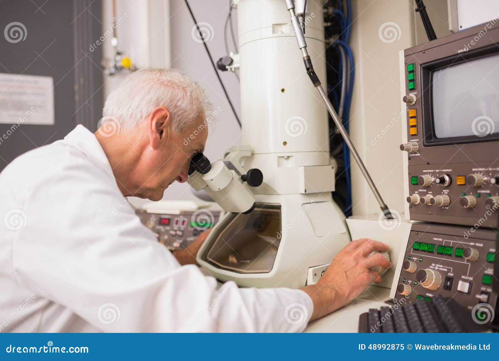 Biochemist Using Large Microscope and Computer Stock Image - Image of ...