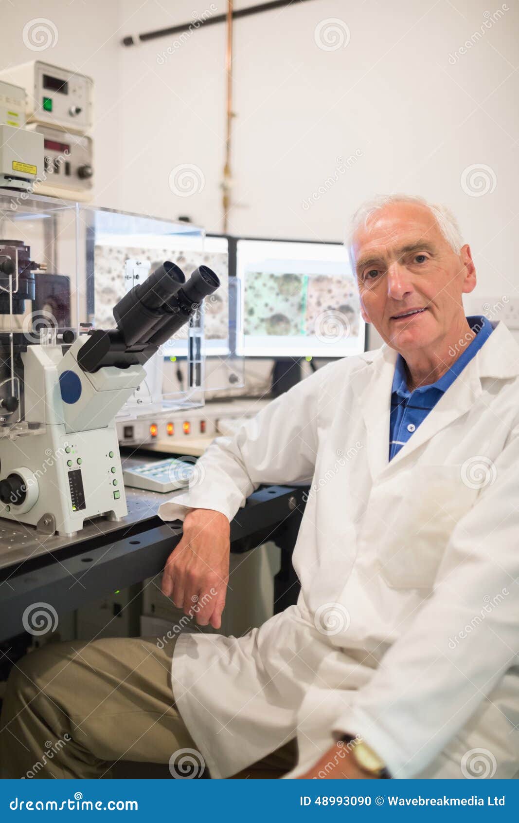 Biochemist Using Large Microscope and Computer Stock Photo - Image of ...