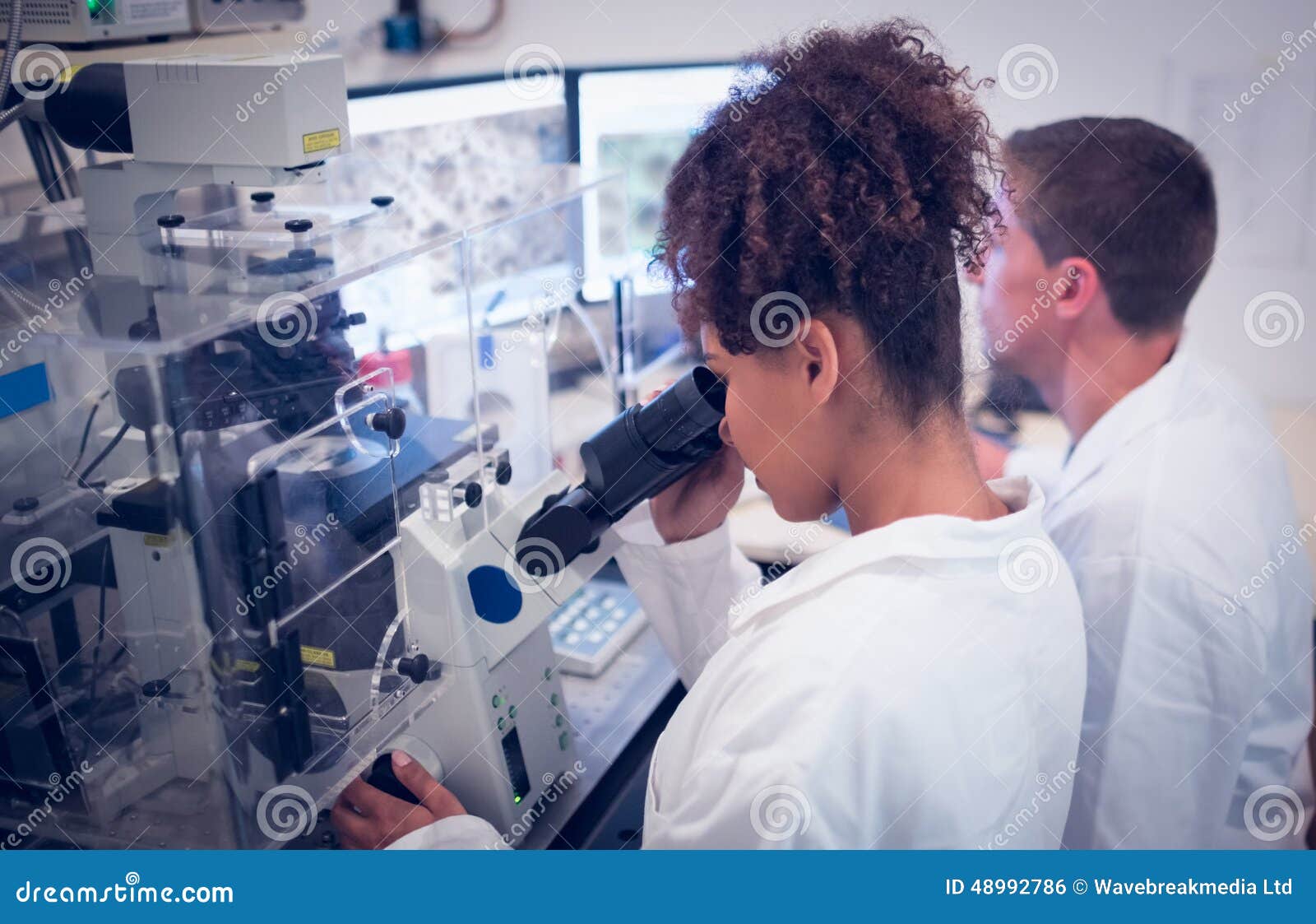 Biochemistry Students Using Large Microscope and Computer Stock Photo ...