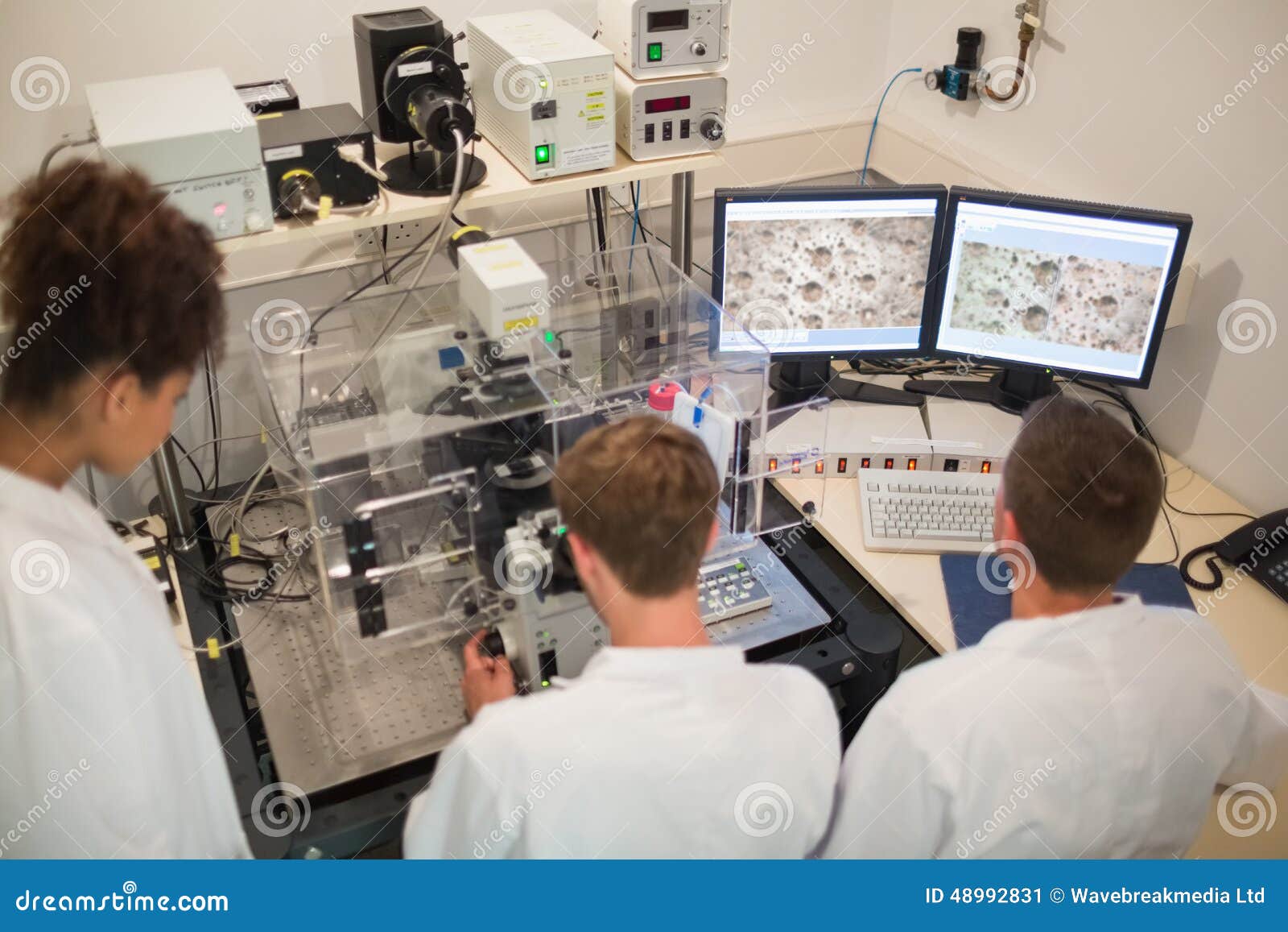 Biochemistry Students Using Large Microscope and Computer Stock Image ...