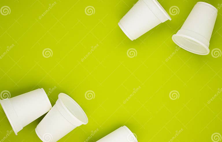 Biodegradable Beverage Containers on a Green Background, Space for Text ...