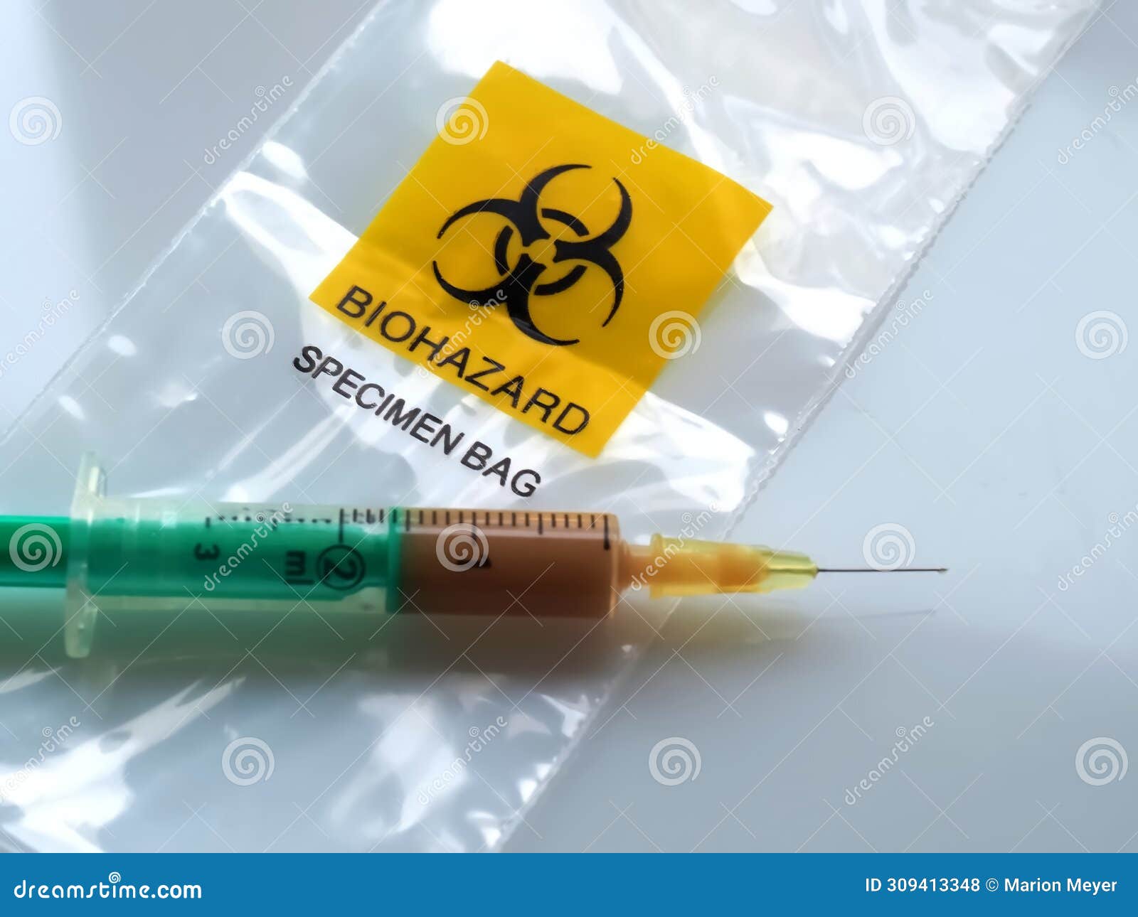 Biohazard Specimen Bag with a Syringe and Brown Liquid Stock Photo ...