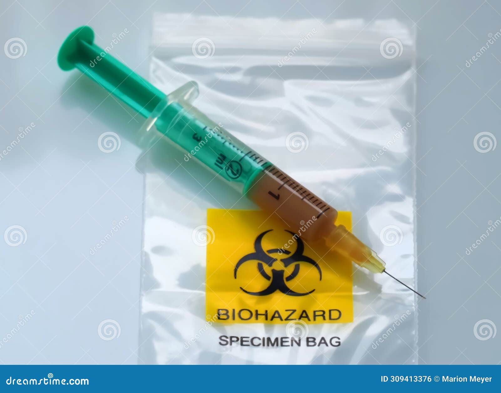 Biohazard Specimen Bag with a Syringe and Brown Liquid Stock Photo ...