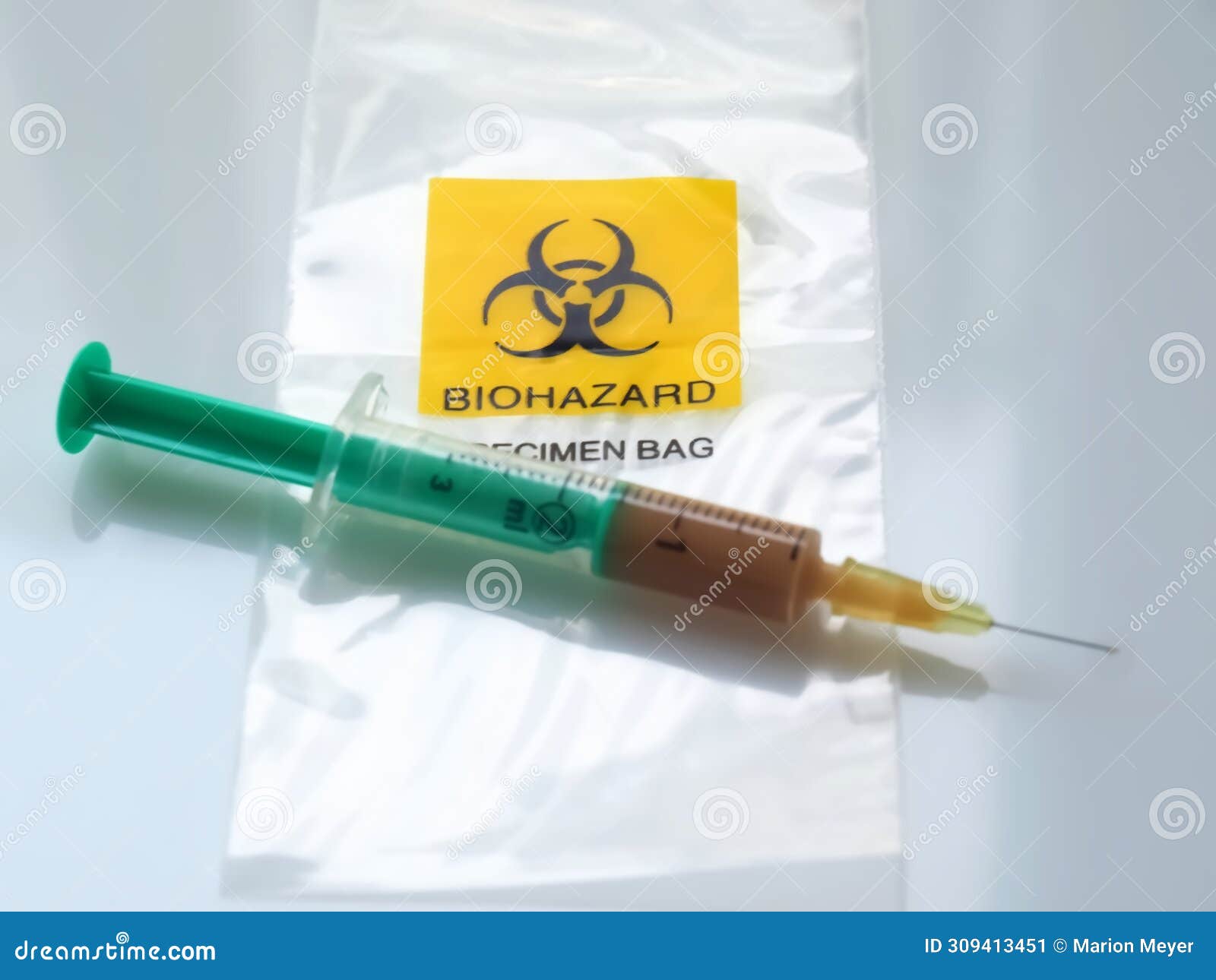 Biohazard Specimen Bag with a Syringe and Brown Liquid Stock Image ...