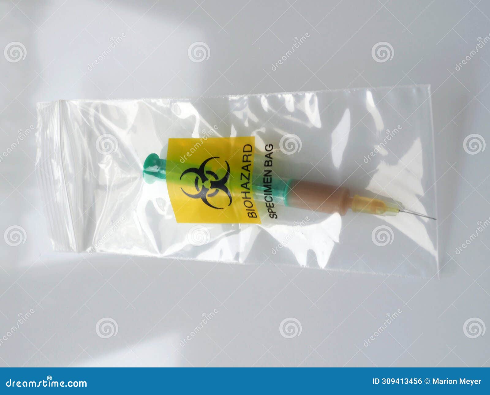 Biohazard Specimen Bag with a Syringe and Brown Liquid Stock Photo ...