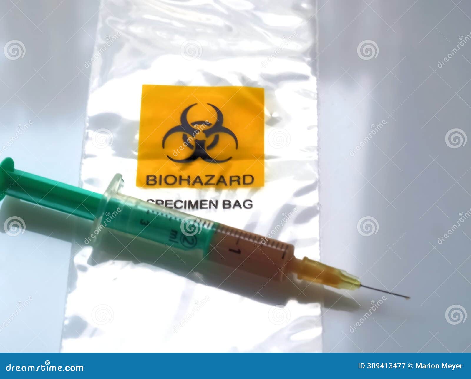 Biohazard Specimen Bag with a Syringe and Brown Liquid Stock Image ...