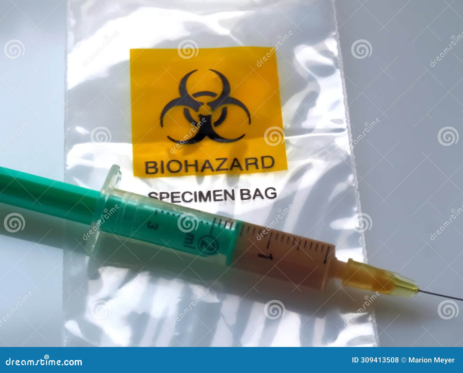 Biohazard Specimen Bag with a Syringe and Brown Liquid Stock Photo ...