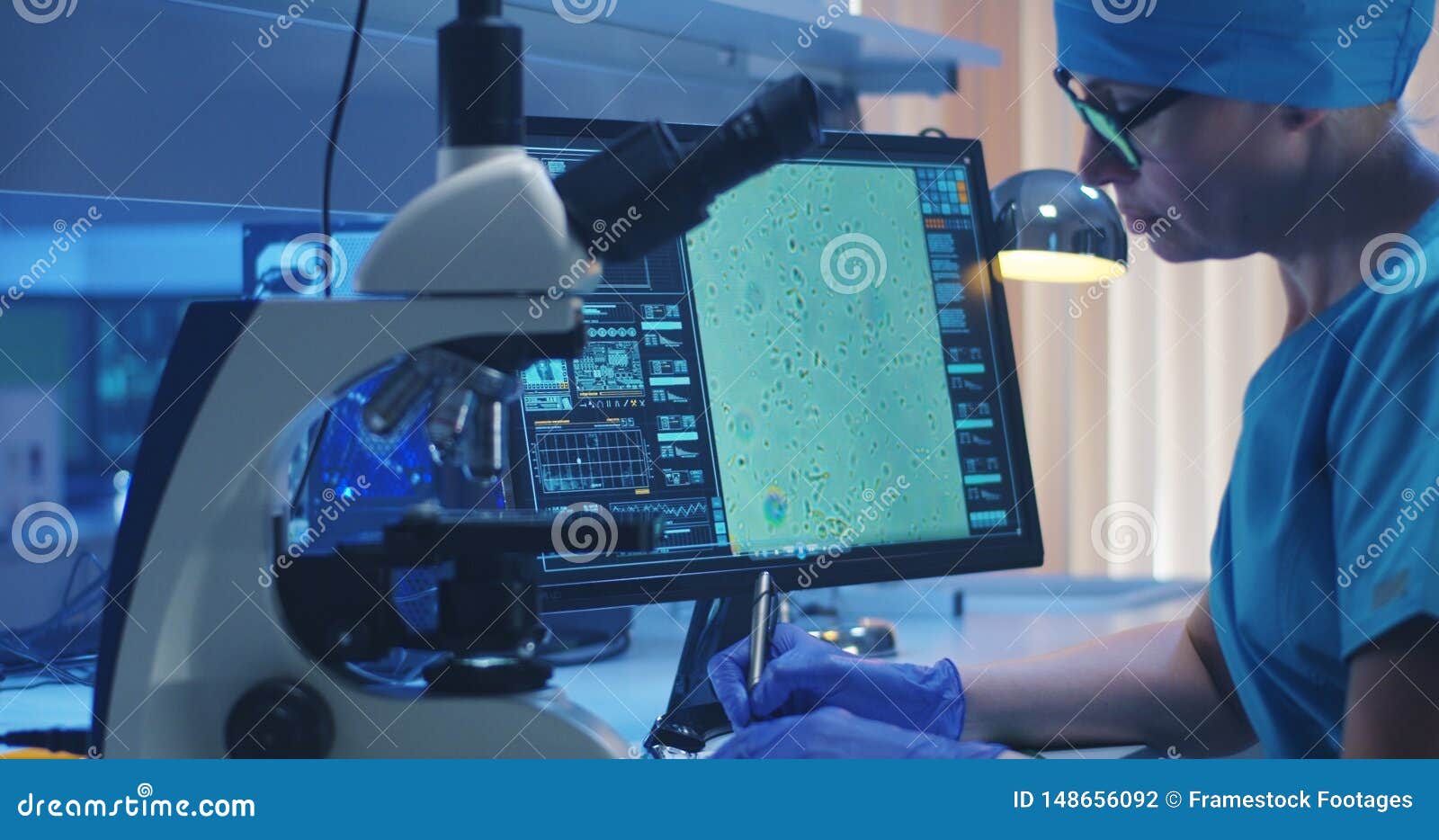 Biologist Analyzing Sample with Microscope Stock Photo - Image of ...