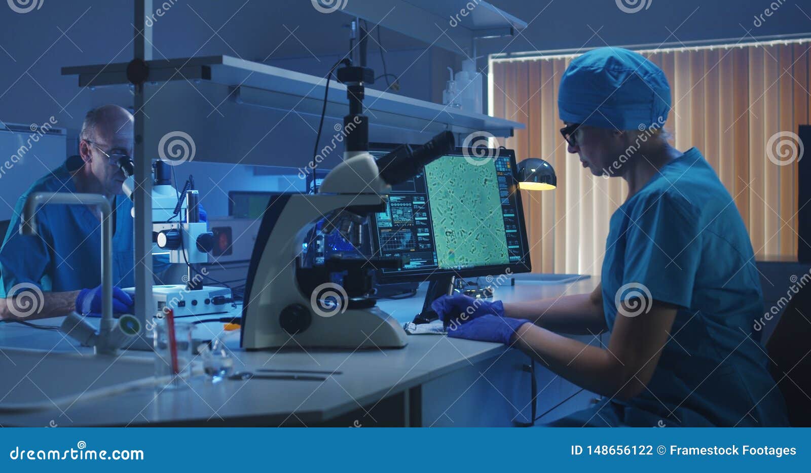 Biologist Analyzing Sample with Microscope Stock Photo - Image of ...