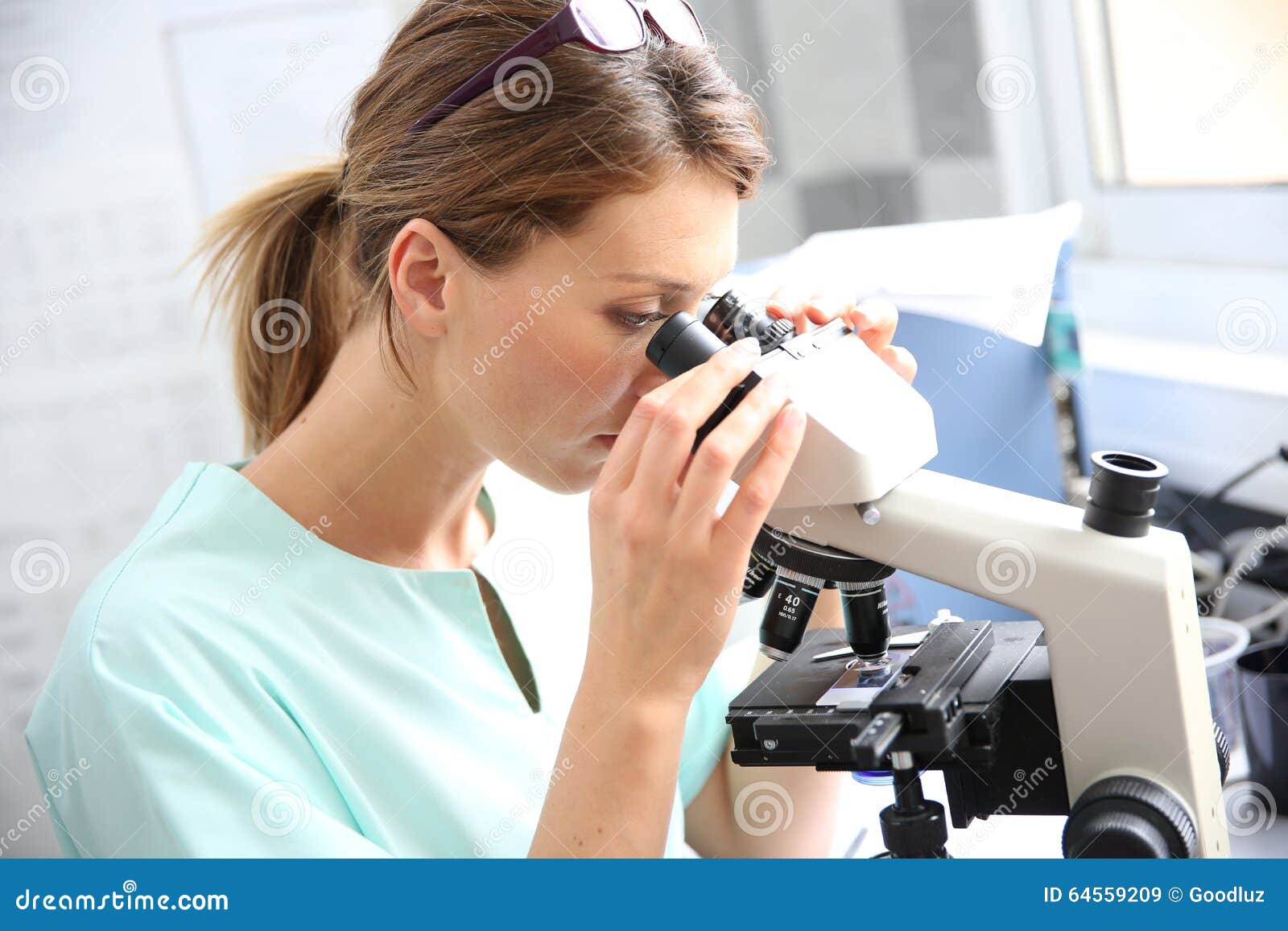 Biologist Checking Samples through Microscope Stock Image - Image of ...