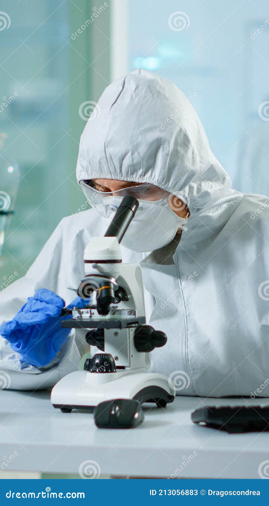 Biologist Doctor in Coverall Checking DNA Sample on Microscope Stock ...