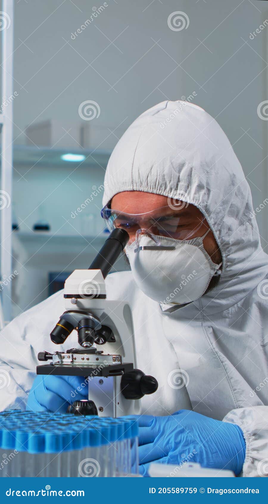 Biologist Doctor in Coverall Checking DNA Sample Using Microscope Stock ...