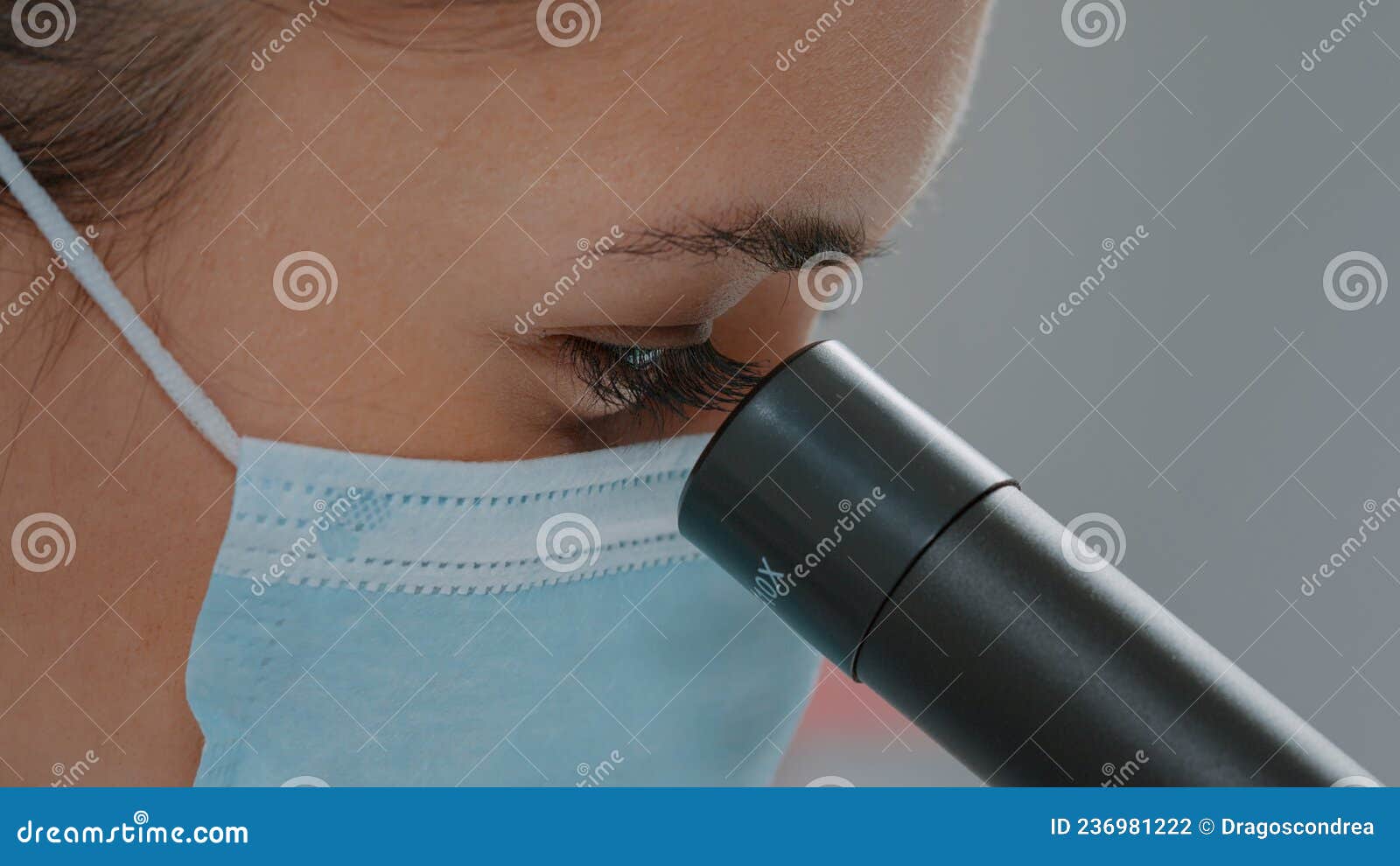 Biologist with Face Mask Using Microscopic Lens on Chemistry Tool Stock ...