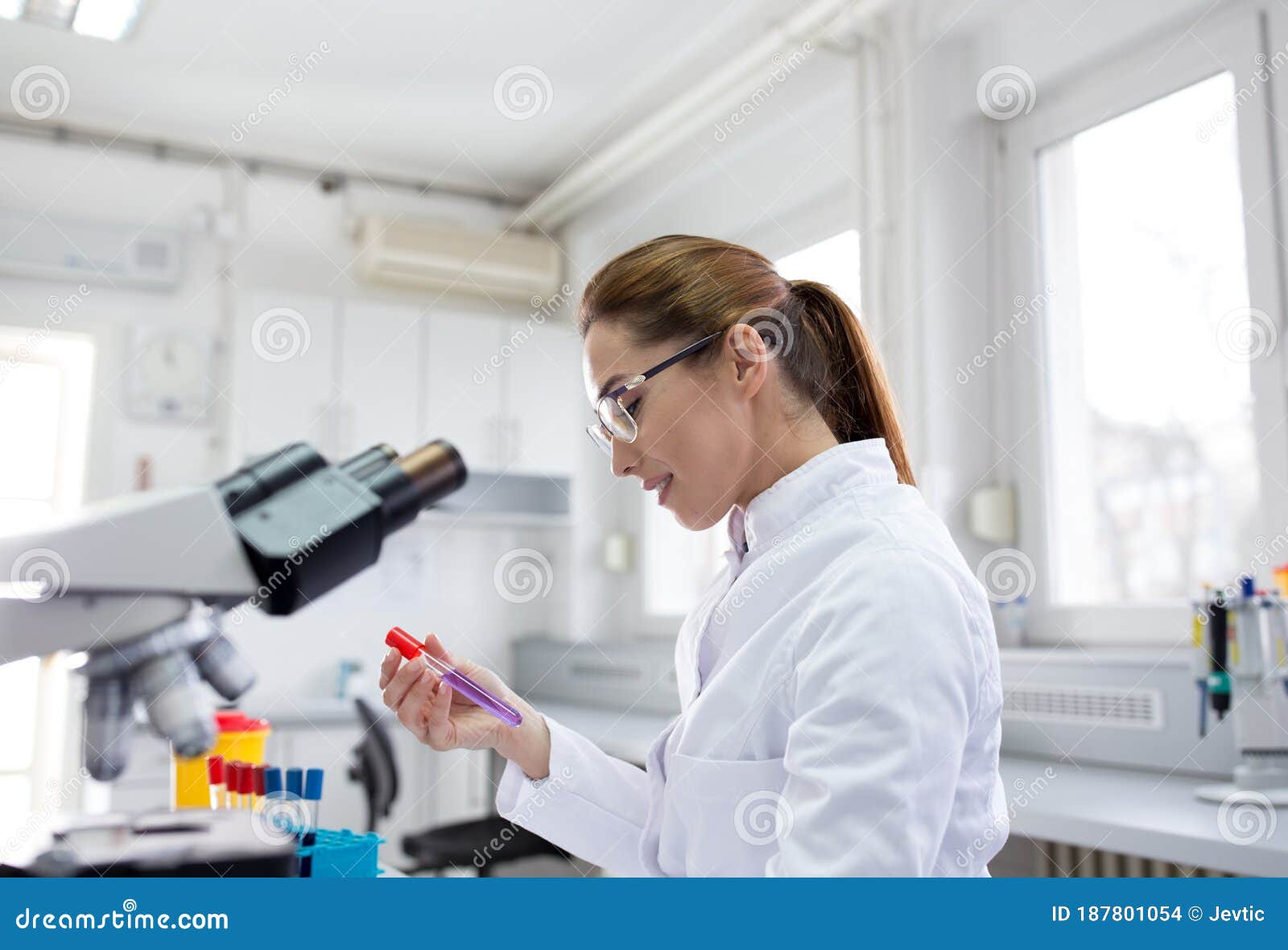 Biologist Looking at Samples in Laboratory Stock Photo - Image of ...