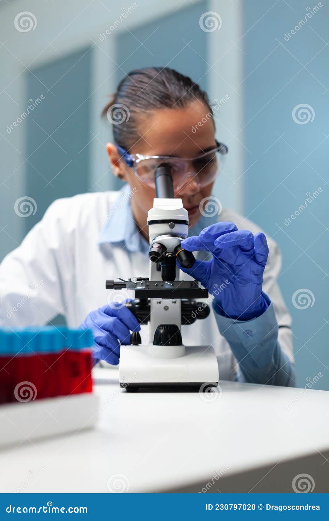 Biologist Woman Analyzing Blood Sample Using Microscope Stock Photo ...