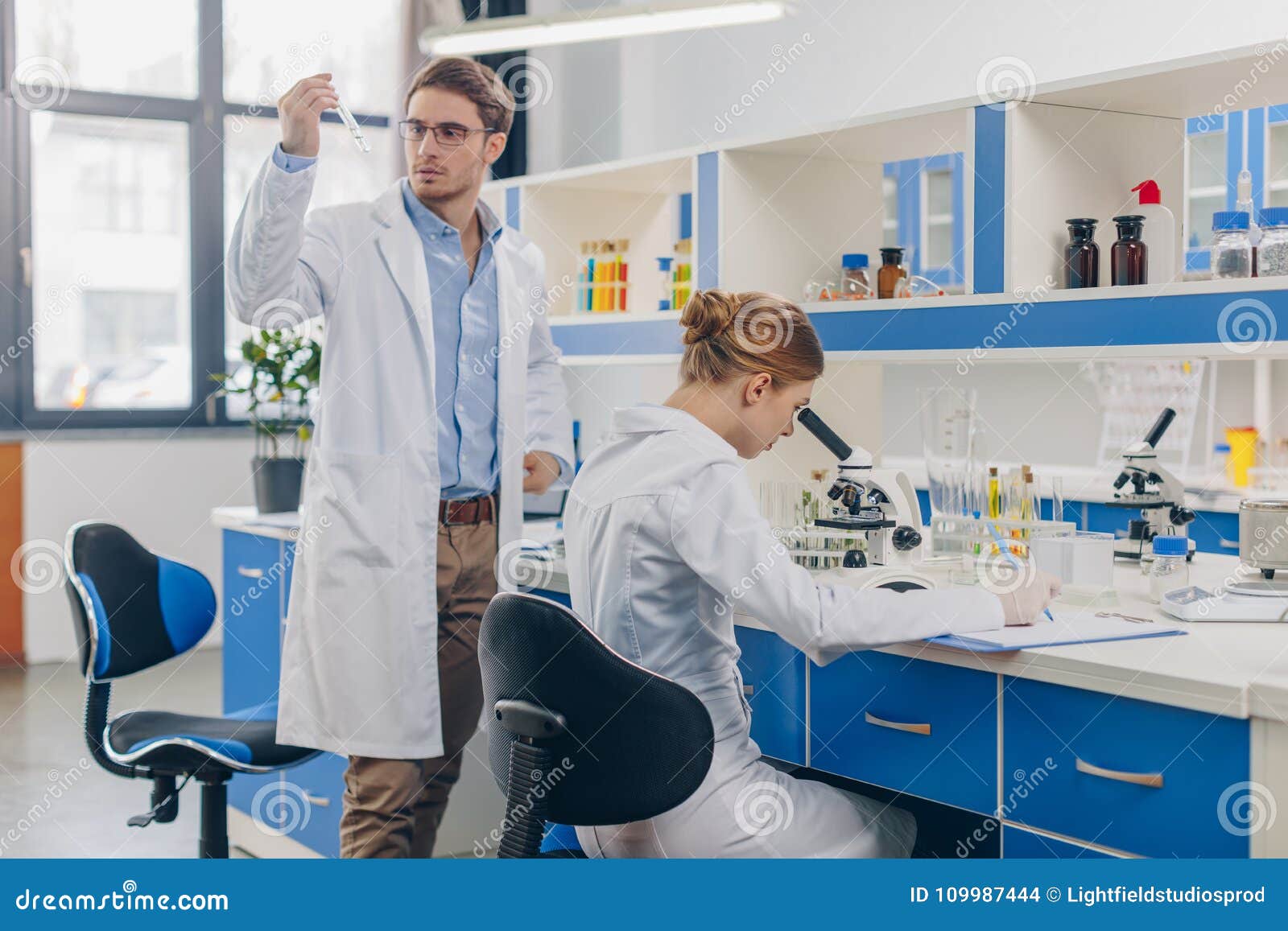 Biologists working in lab stock photo. Image of biochemistry - 109987444