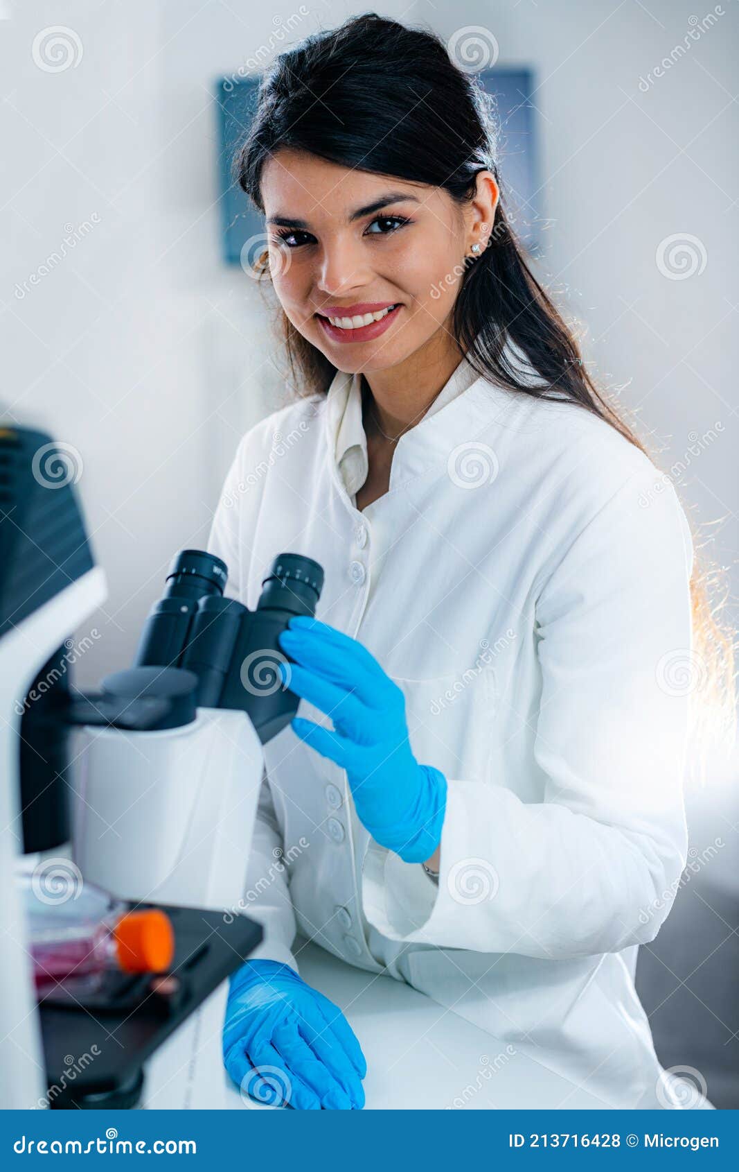 Biology Student Researcher Looking through the Microscope Stock Photo ...