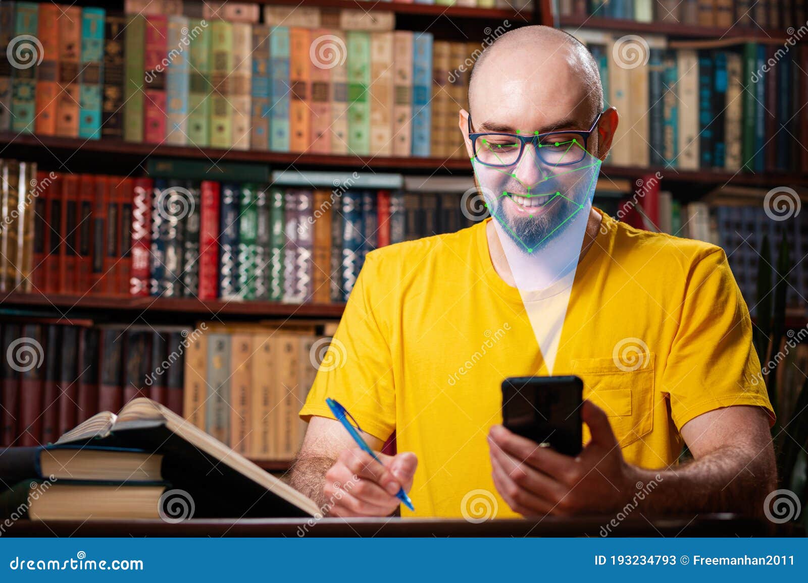 Biometric Verification. Young Bald Man with the Phone Stock Image ...