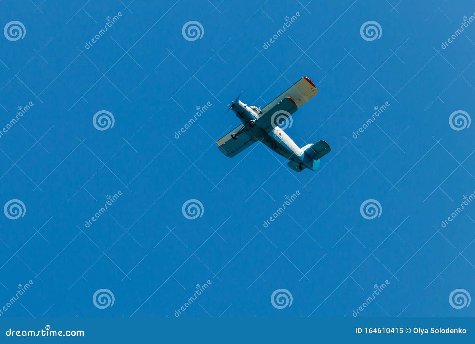 Biplane flying in sky stock image. Image of demonstration - 164610415