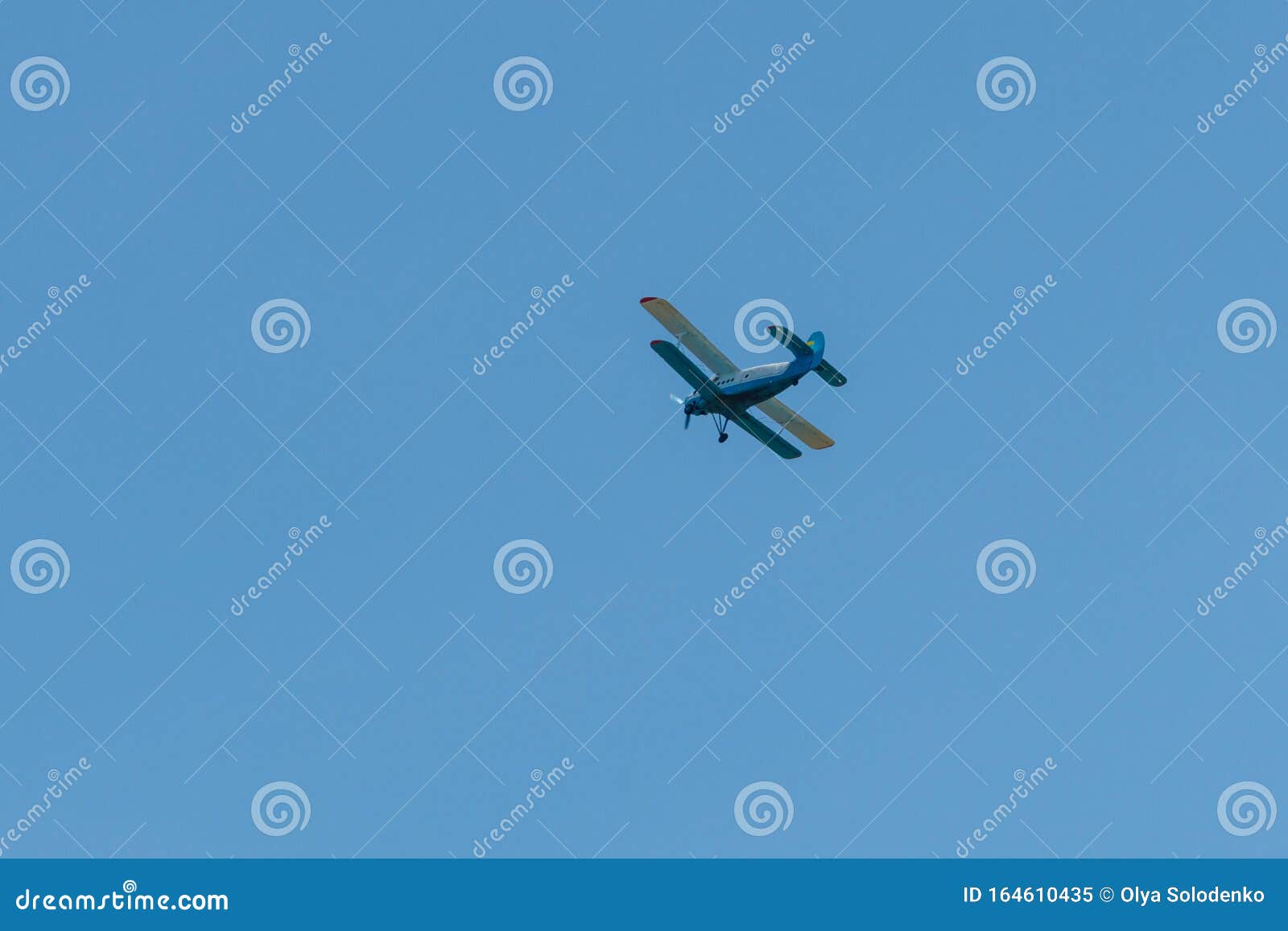 Biplane flying in sky stock image. Image of flight, airport - 164610435
