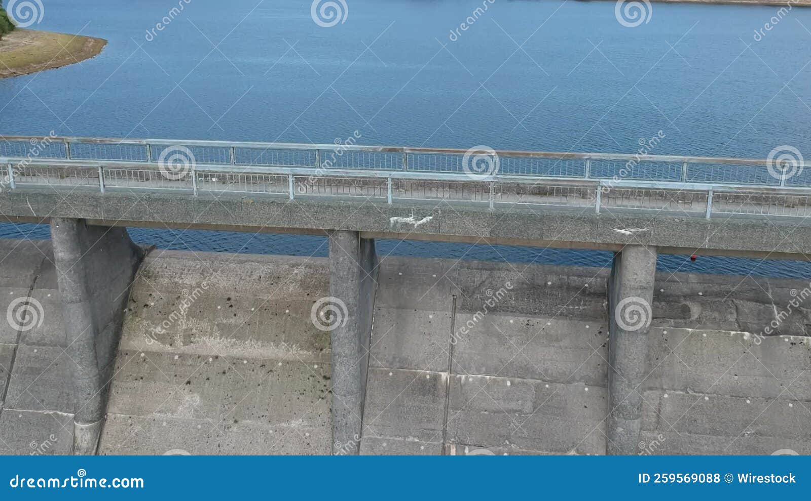 Bird S Eye View of a Construction on a Water Dam Surrounded by Greenery ...