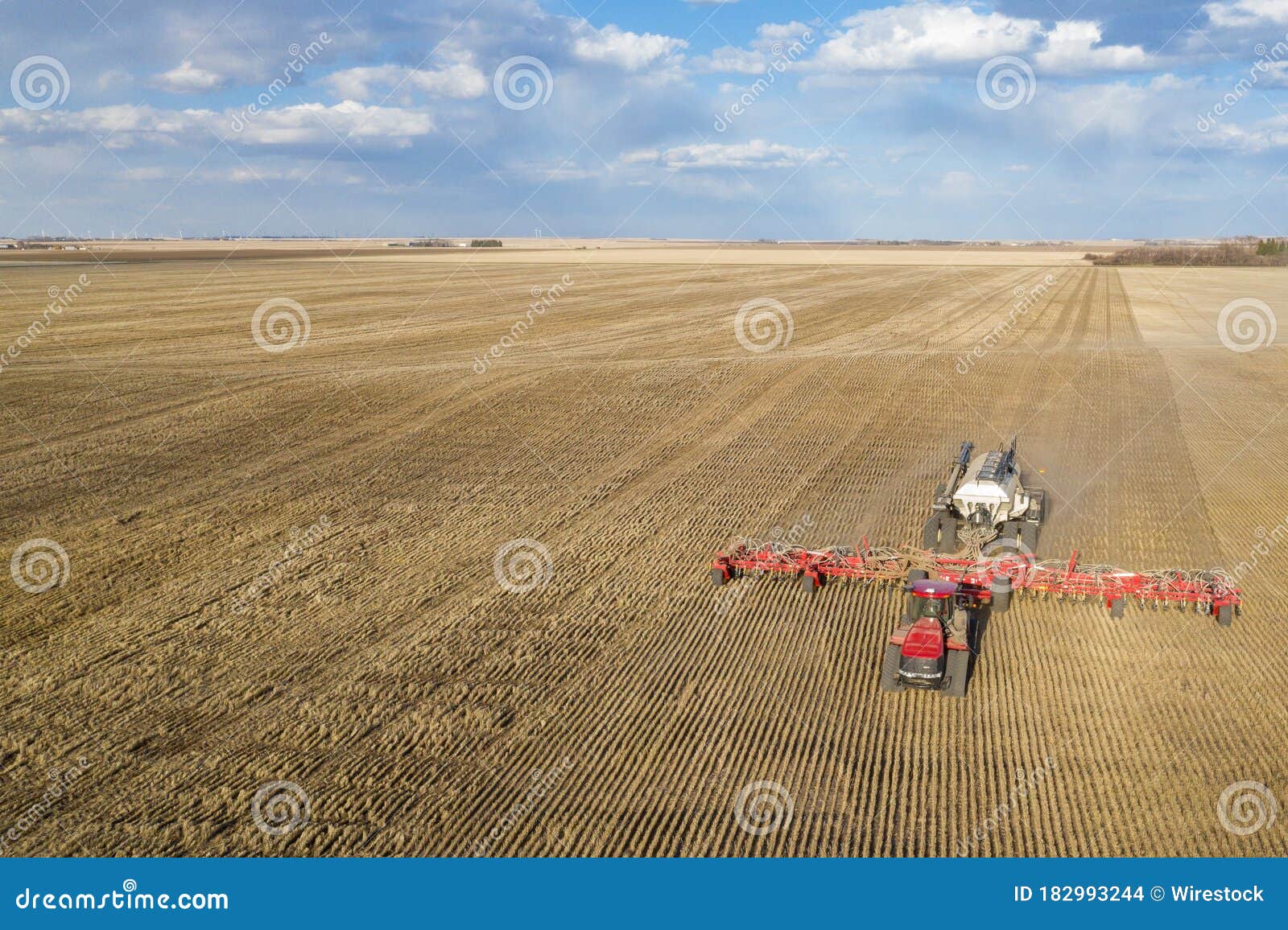 Bird S-eye View of a Farming Field and Seeding Machine during Daytime ...