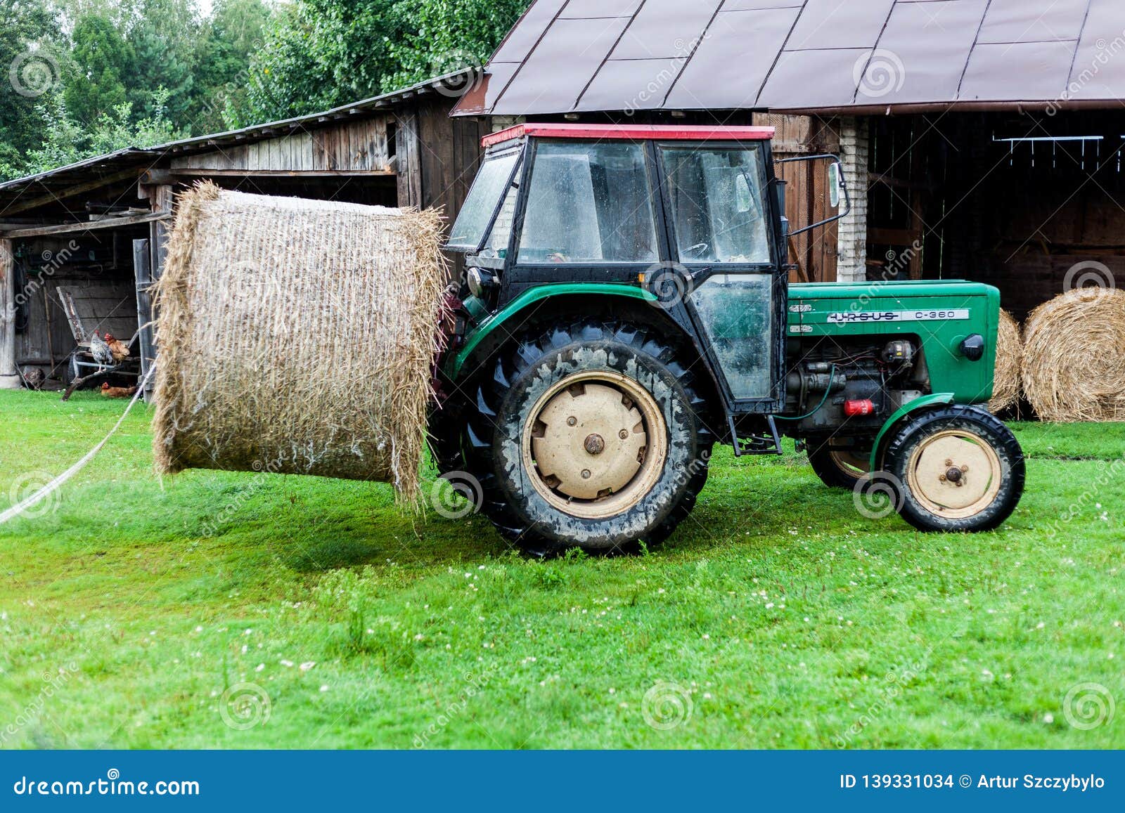 BIRMINGHAM, UK - March 2018 Mini Tractor with Bundle of Haystack ...