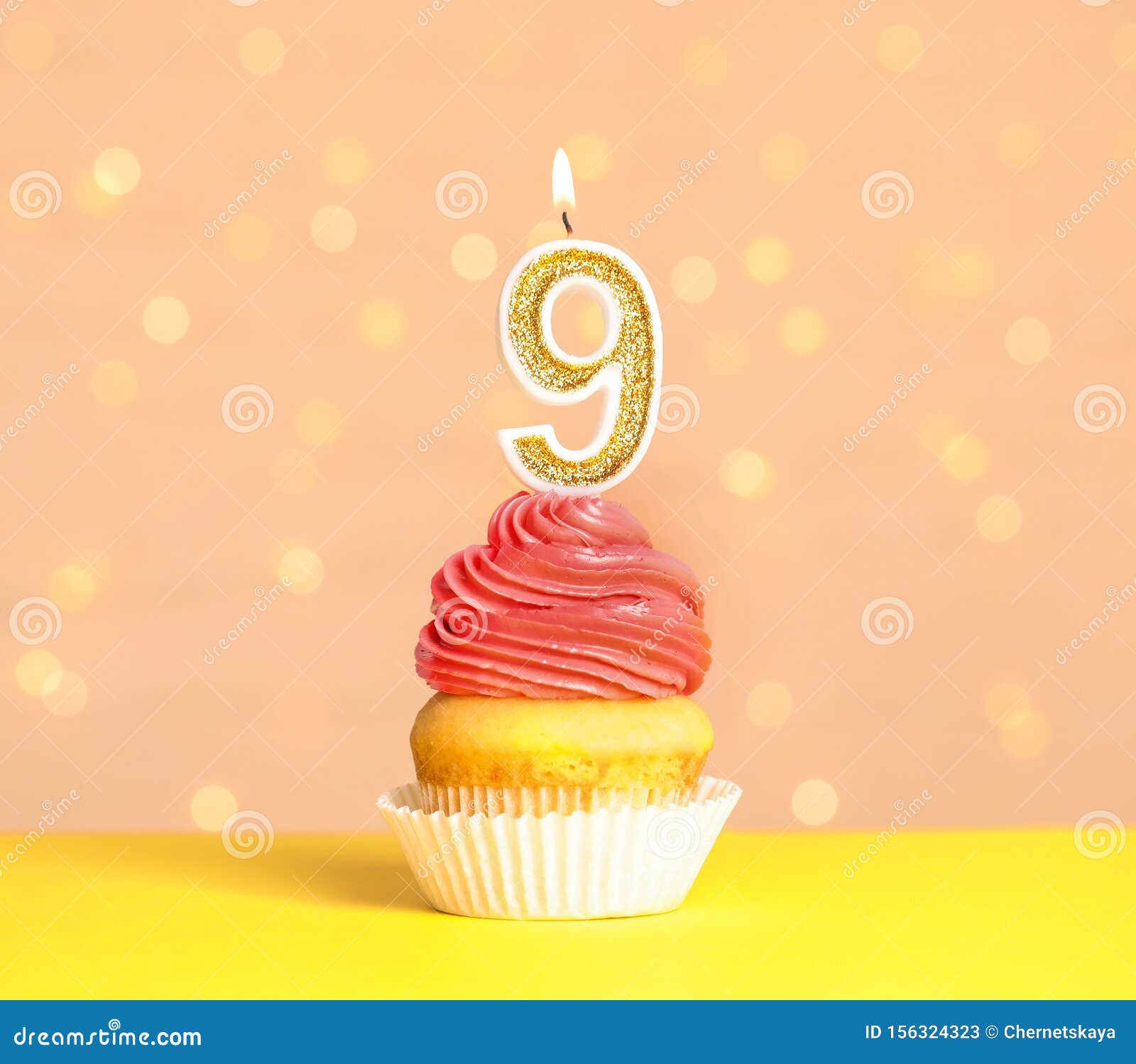 Birthday Cupcake with Number Nine Candle on Table Festive Lights Stock ...
