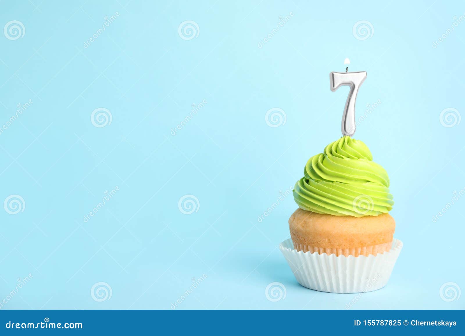 Birthday Cupcake with Number Seven Candle on Blue Background Stock ...